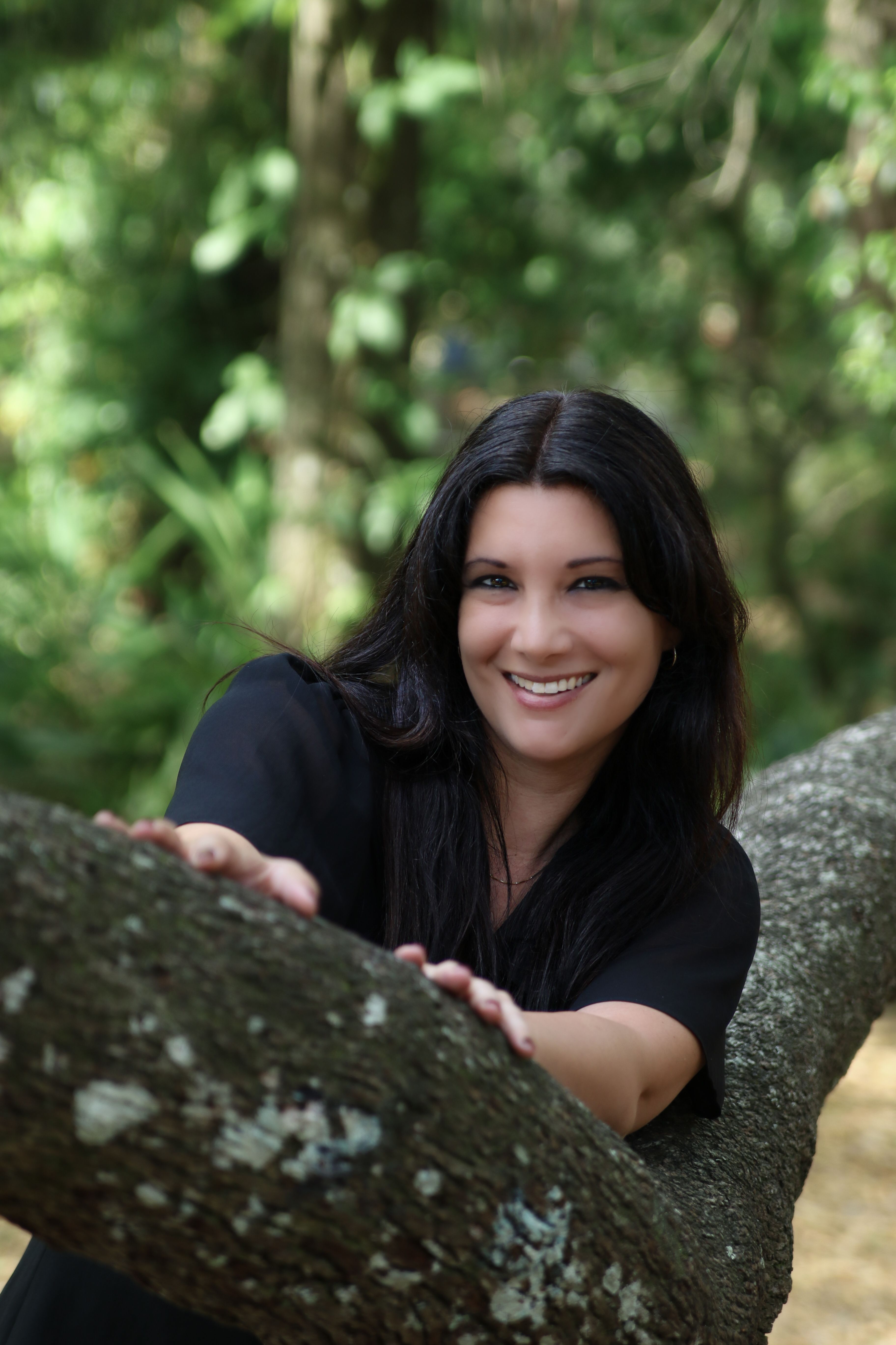 Outdoor Portrait of Smiling Woman on Tree · Free Stock Photo