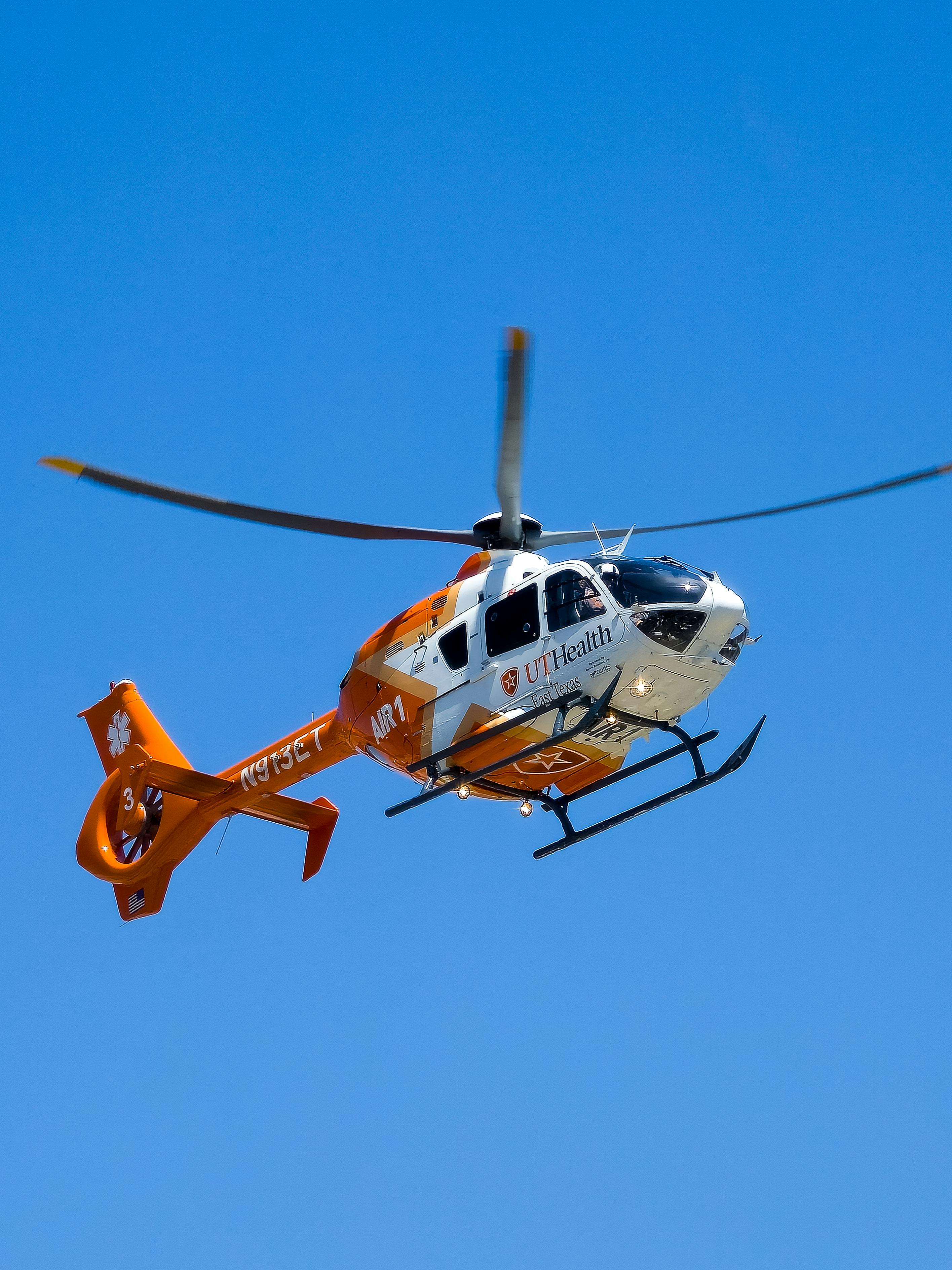 Orange and White Rescue Helicopter in Blue Sky · Free Stock Photo