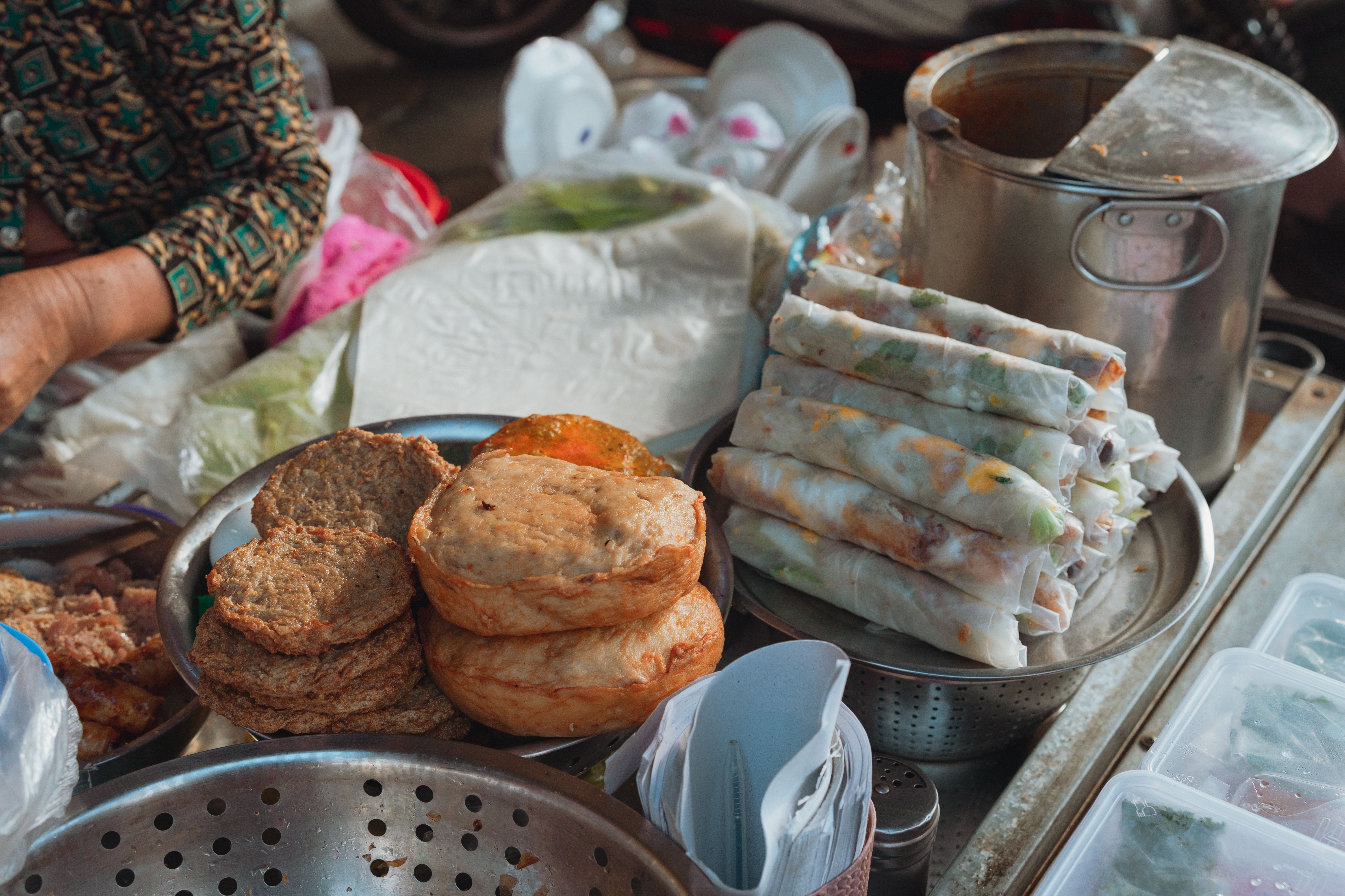 Vietnamese Street Food Market with Rolls and Snacks · Free Stock Photo