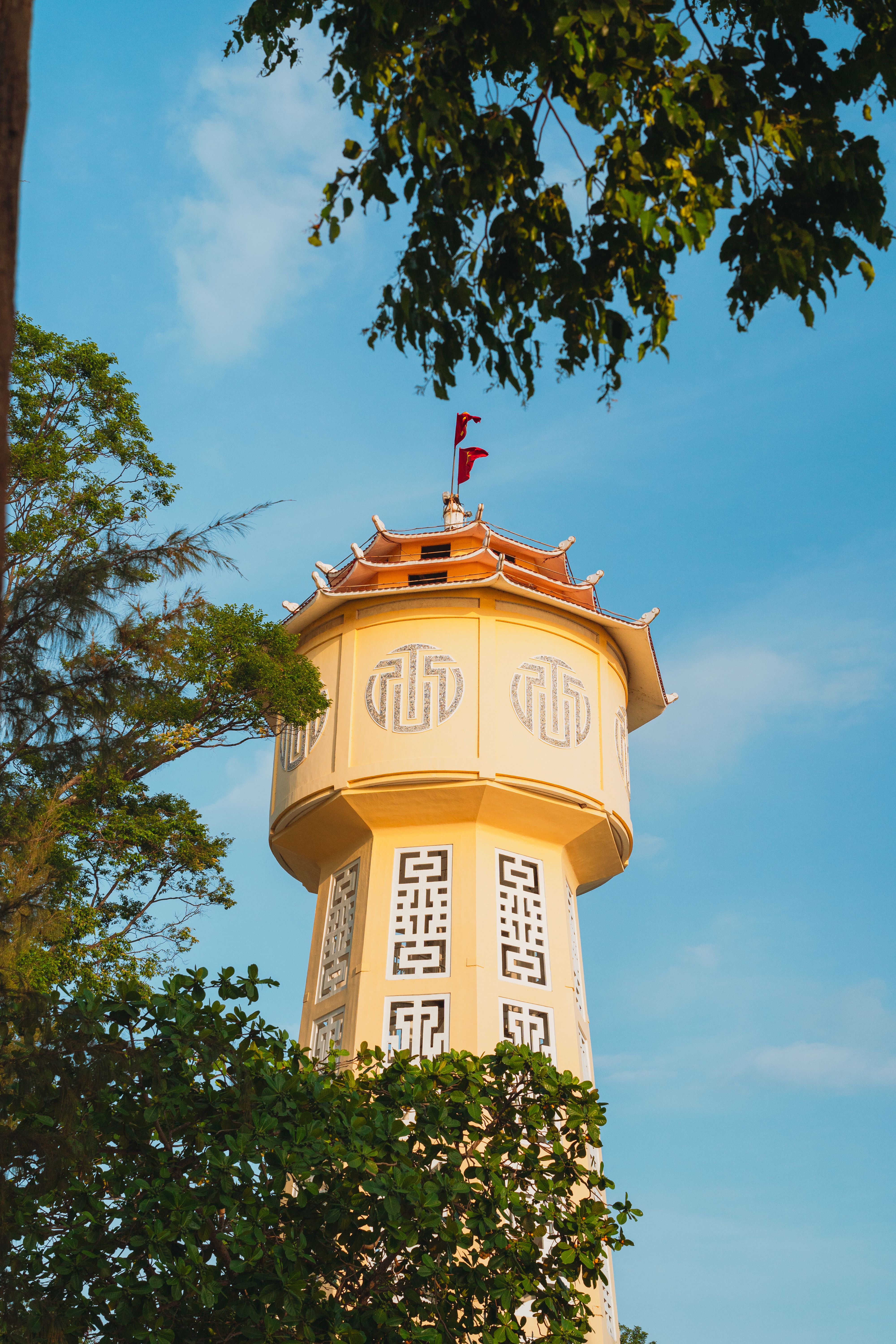 Traditional Tower Against Clear Blue Sky in Vietnam · Free Stock Photo