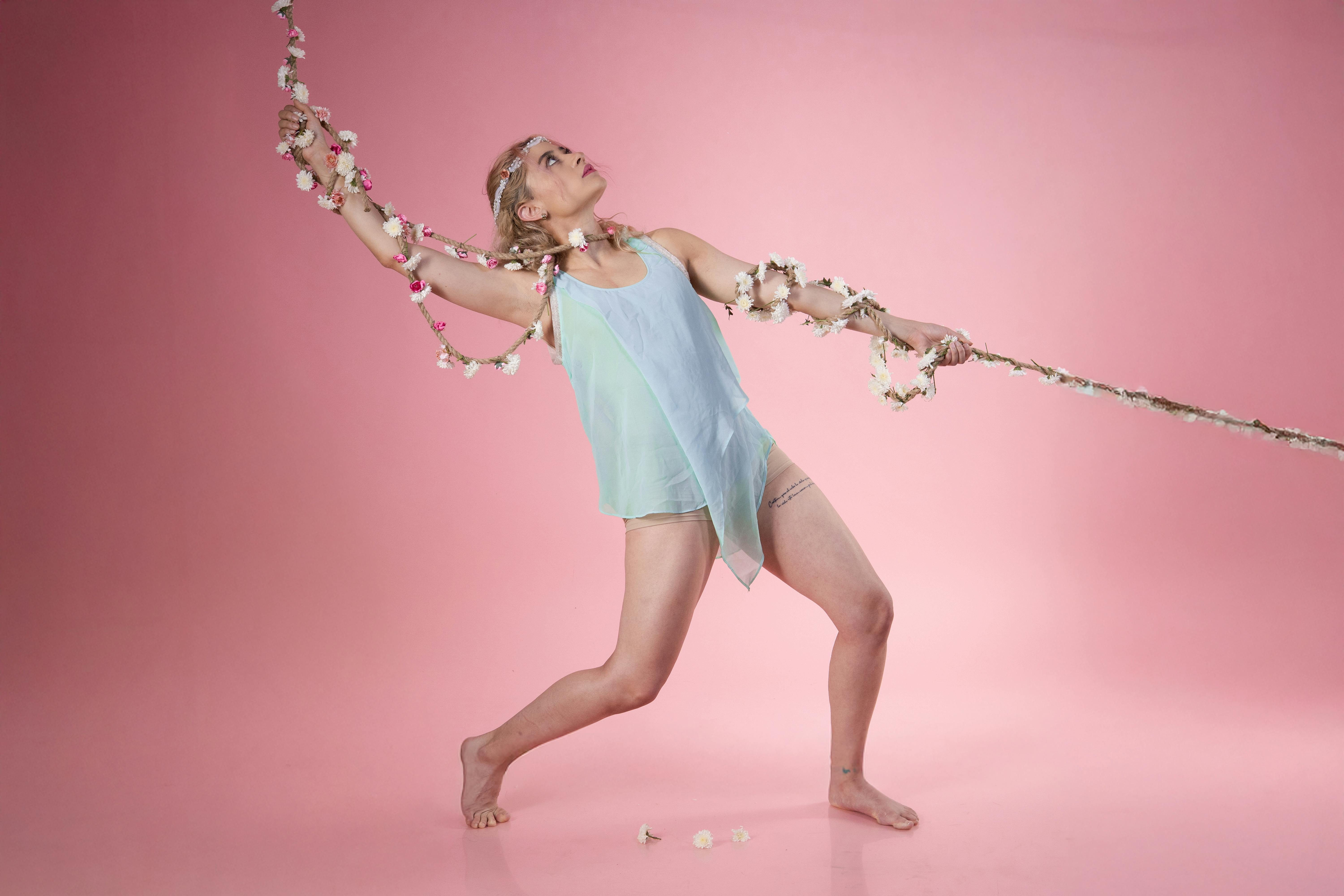 Contemporary Dancer Posing with Floral Rope · Free Stock Photo