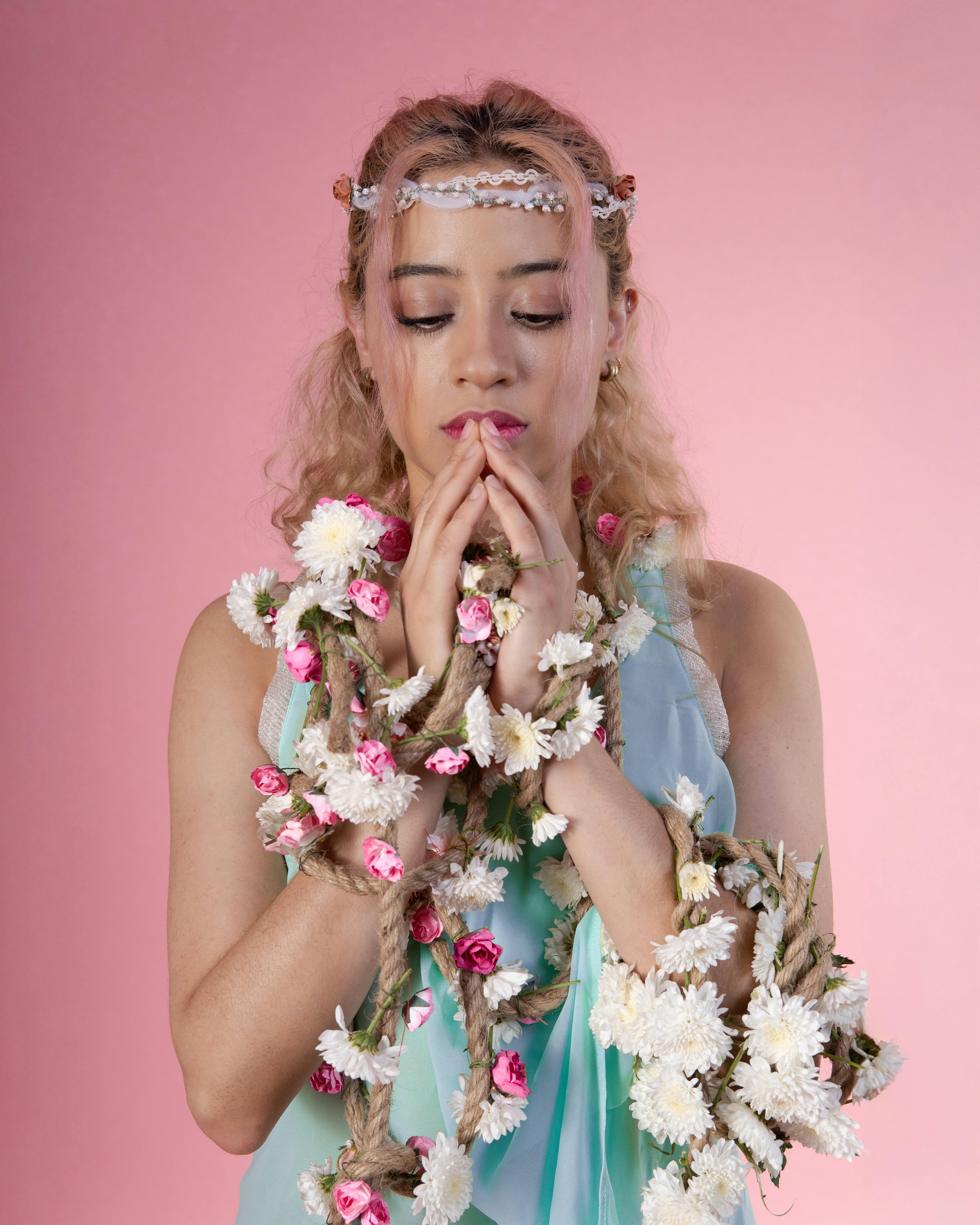 Floral Adorned Dancer in Light Pink Studio · Free Stock Photo