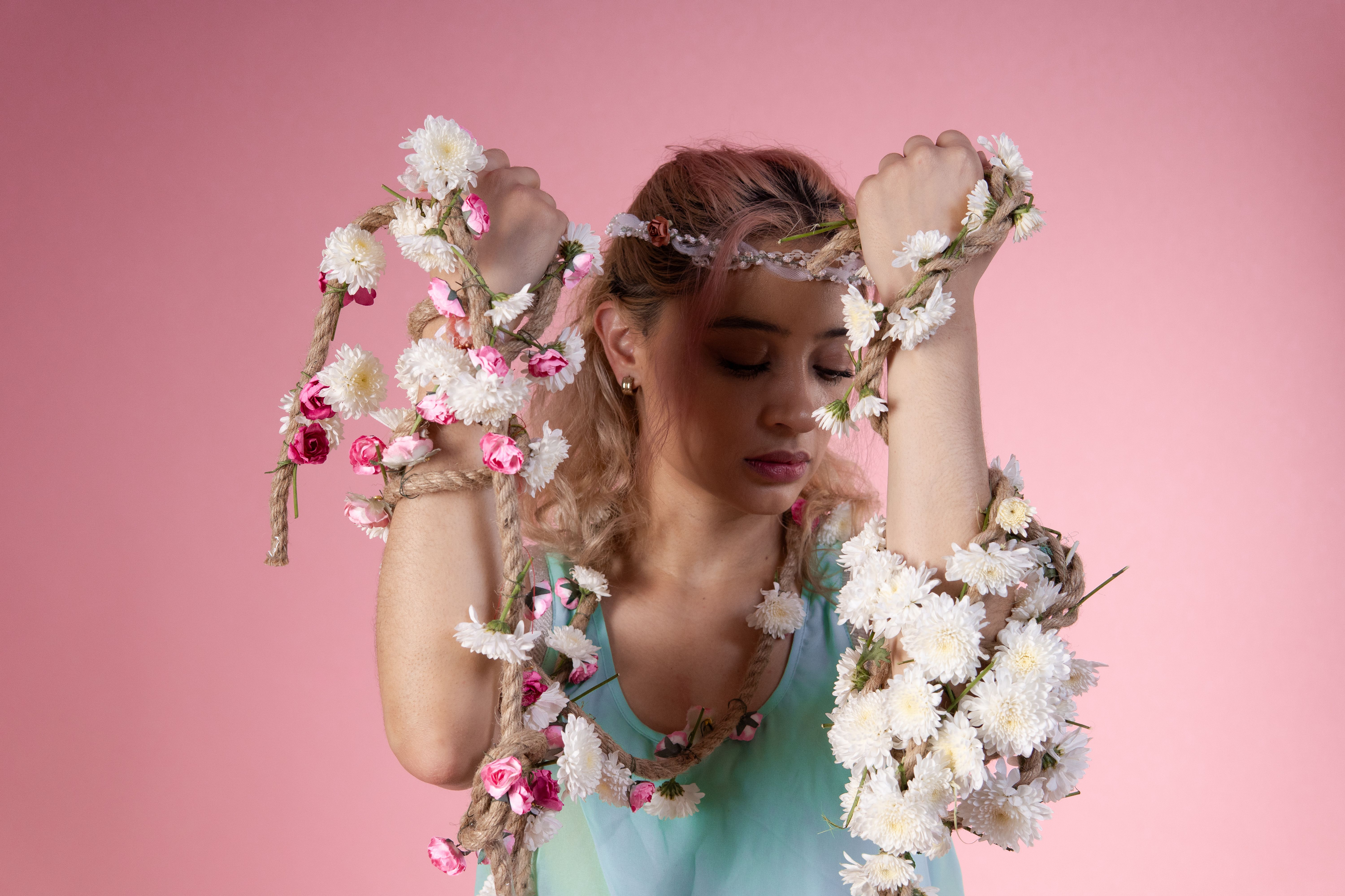 Contemporary Dancer with Floral Decor on Pink Background · Free Stock Photo