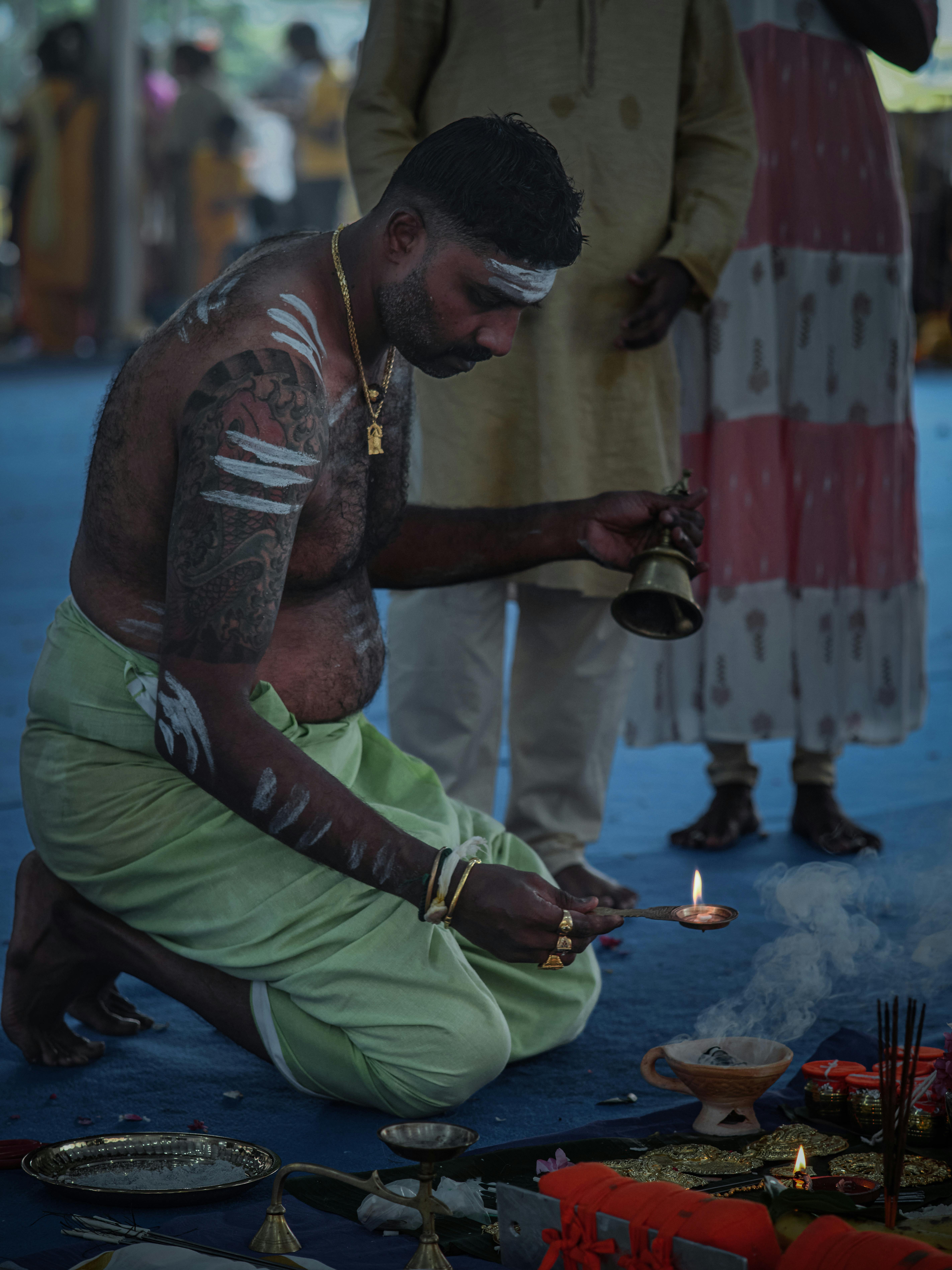 Cultural Ritual with Traditional Attire and Offerings · Free Stock Photo