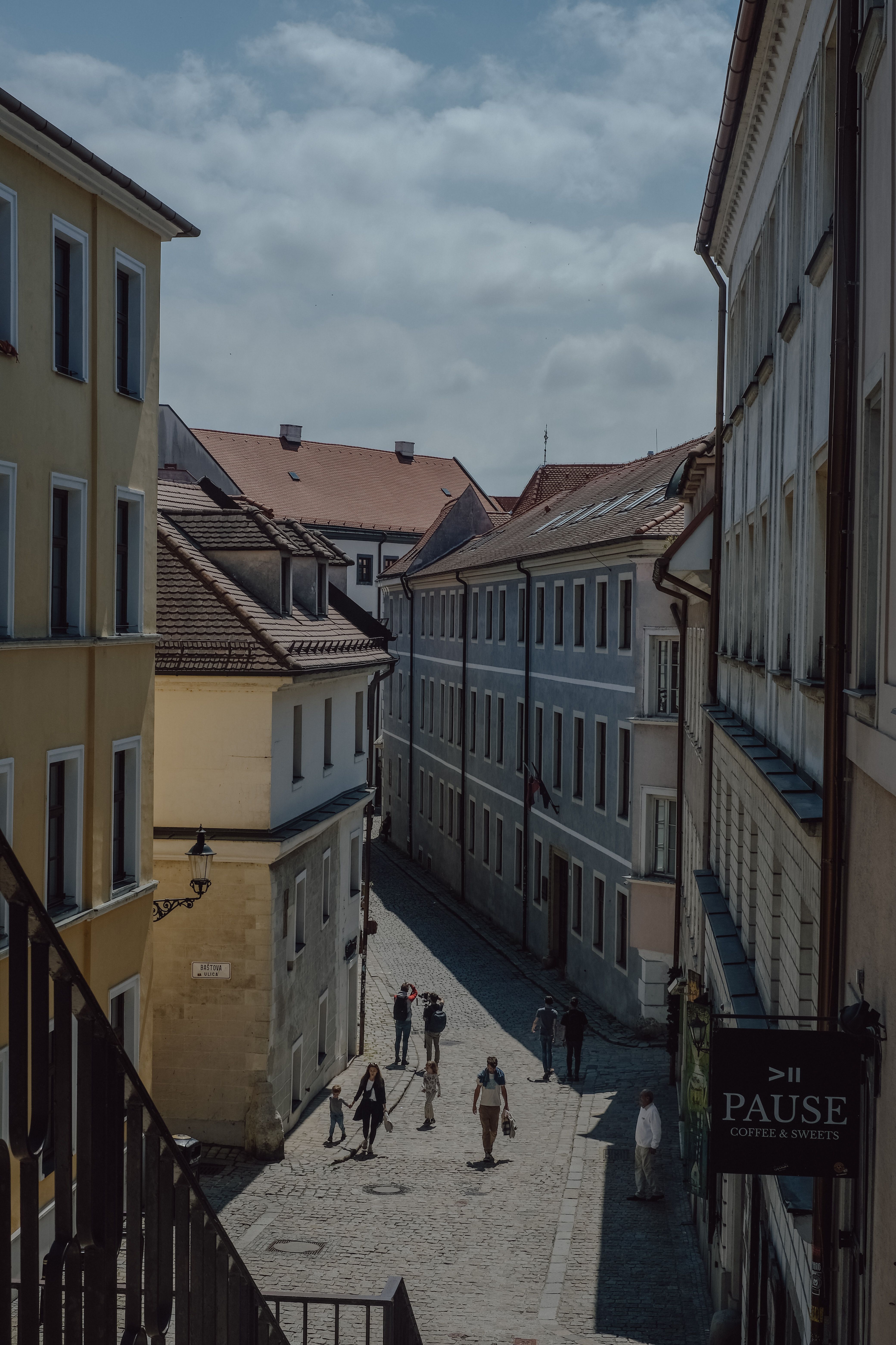Charming European Street with Pedestrians · Free Stock Photo