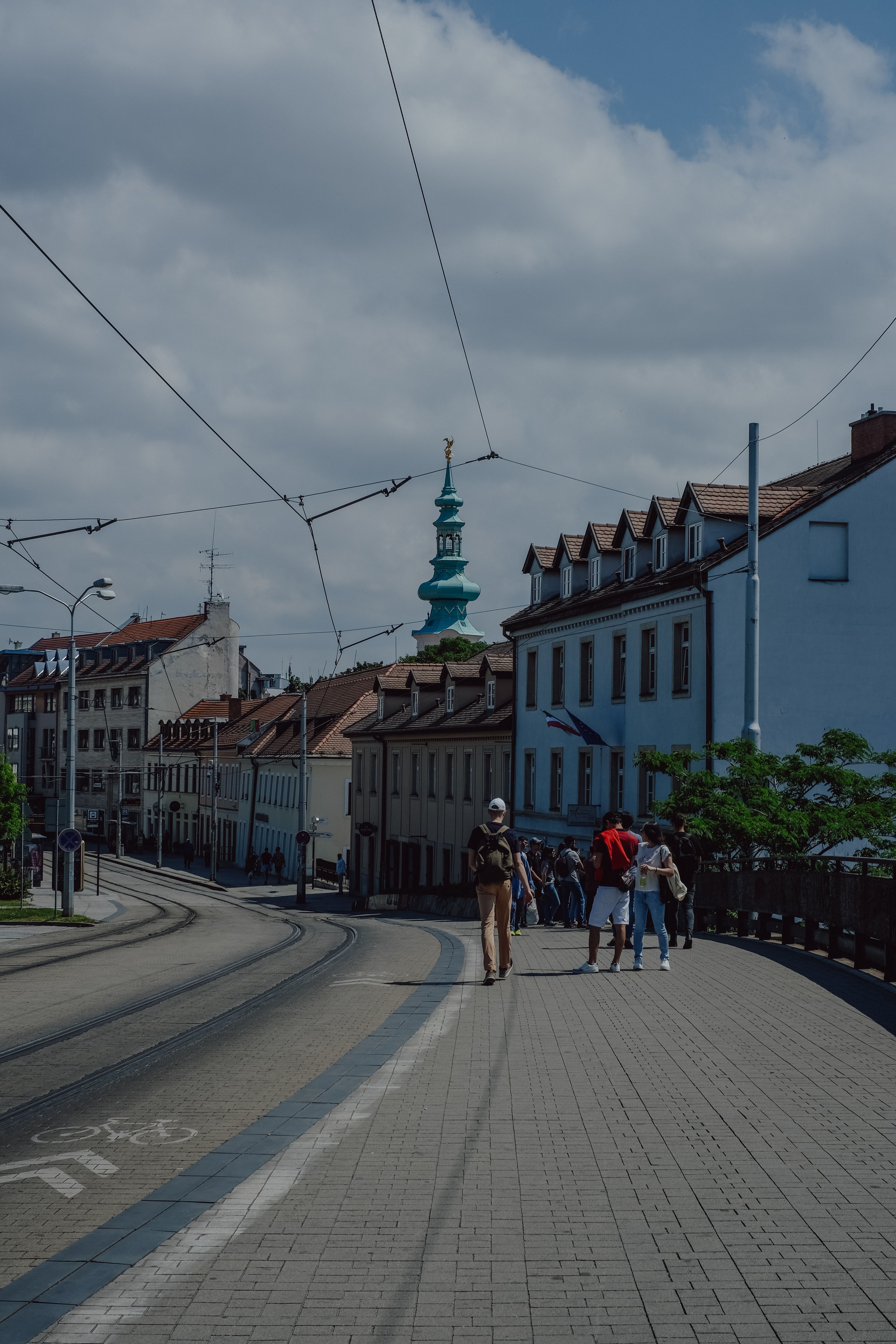 Street View of Urban Architecture with Tram Tracks · Free Stock Photo