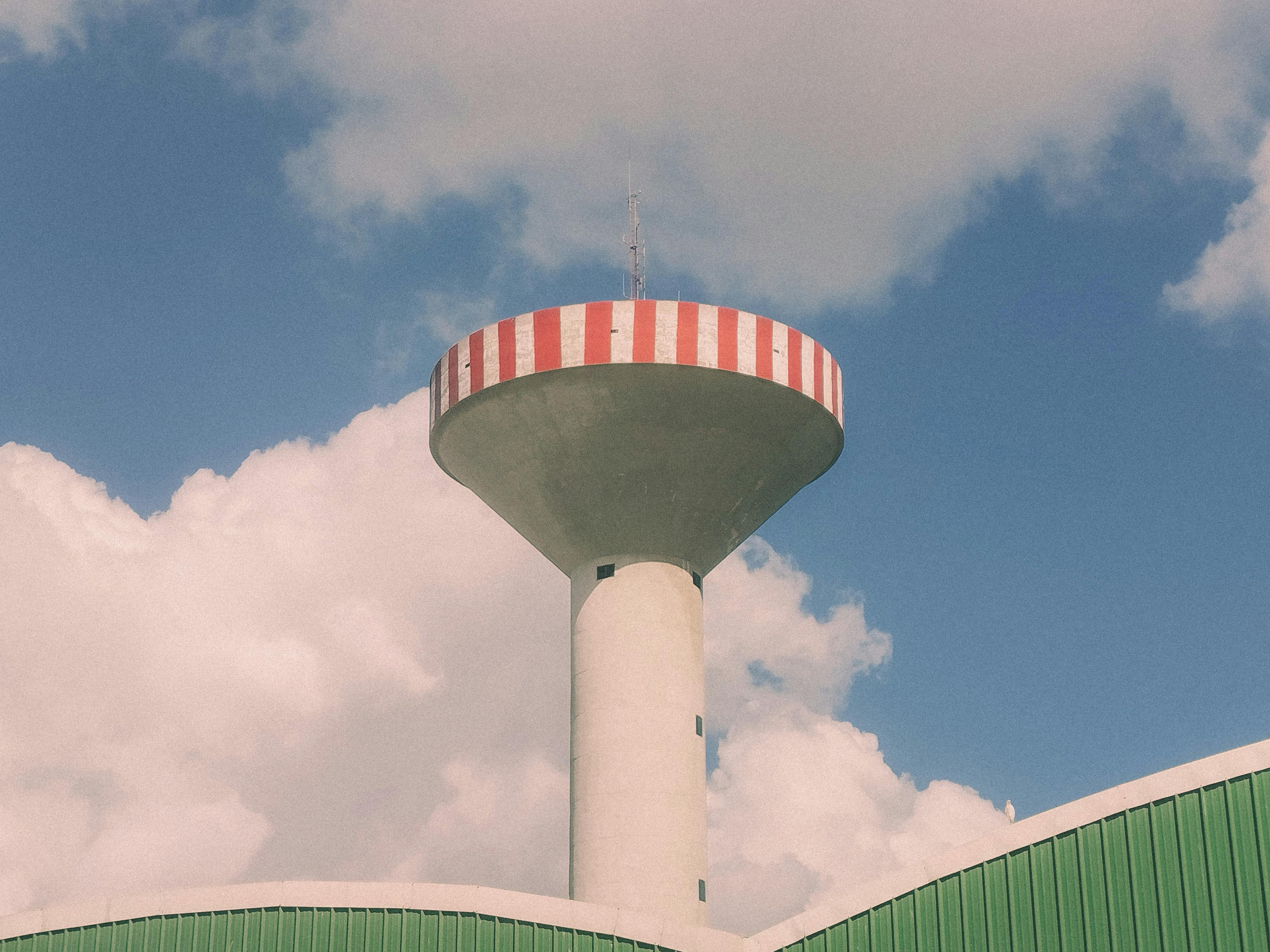 Modern Water Tower Against Clear Blue Sky · Free Stock Photo