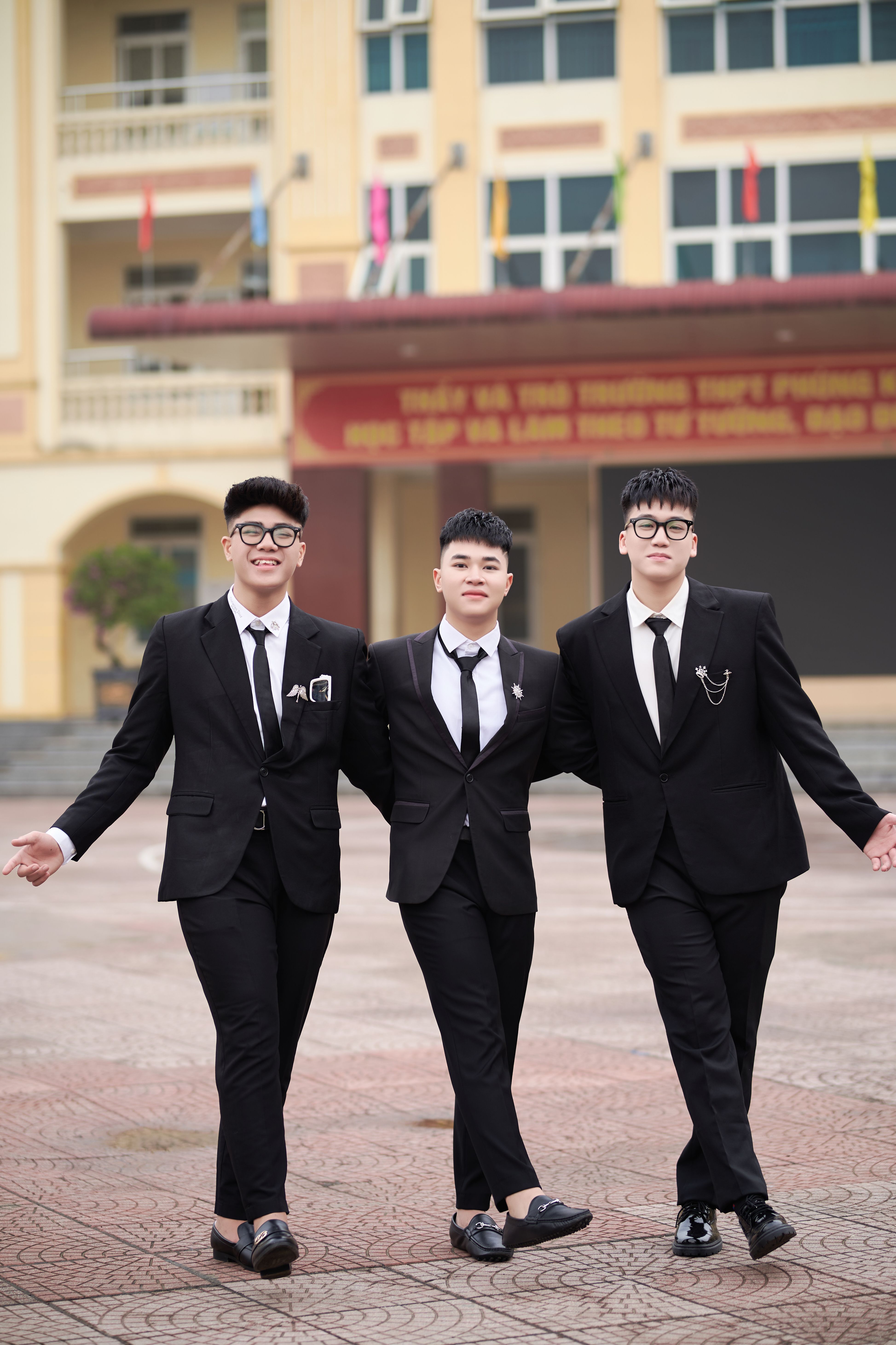 Three Friends in Suits Walking Outdoors · Free Stock Photo