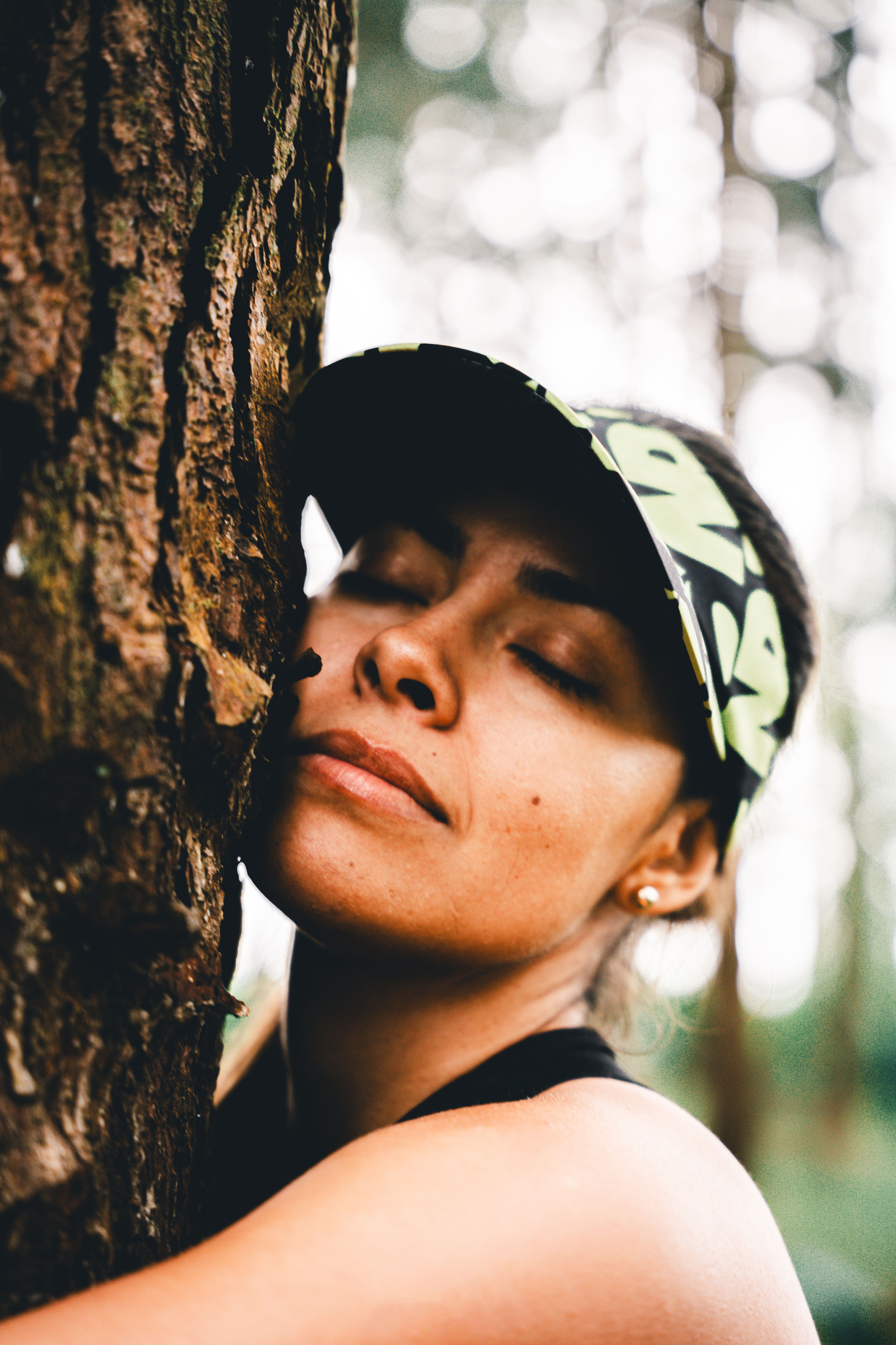 Woman Embracing a Tree in a Serene Forest · Free Stock Photo