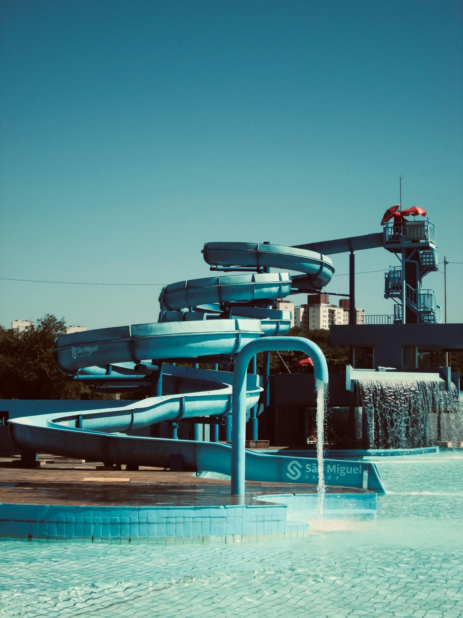 Spiral Water Slide in Bright Sunlit Aqua Park · Free Stock Photo