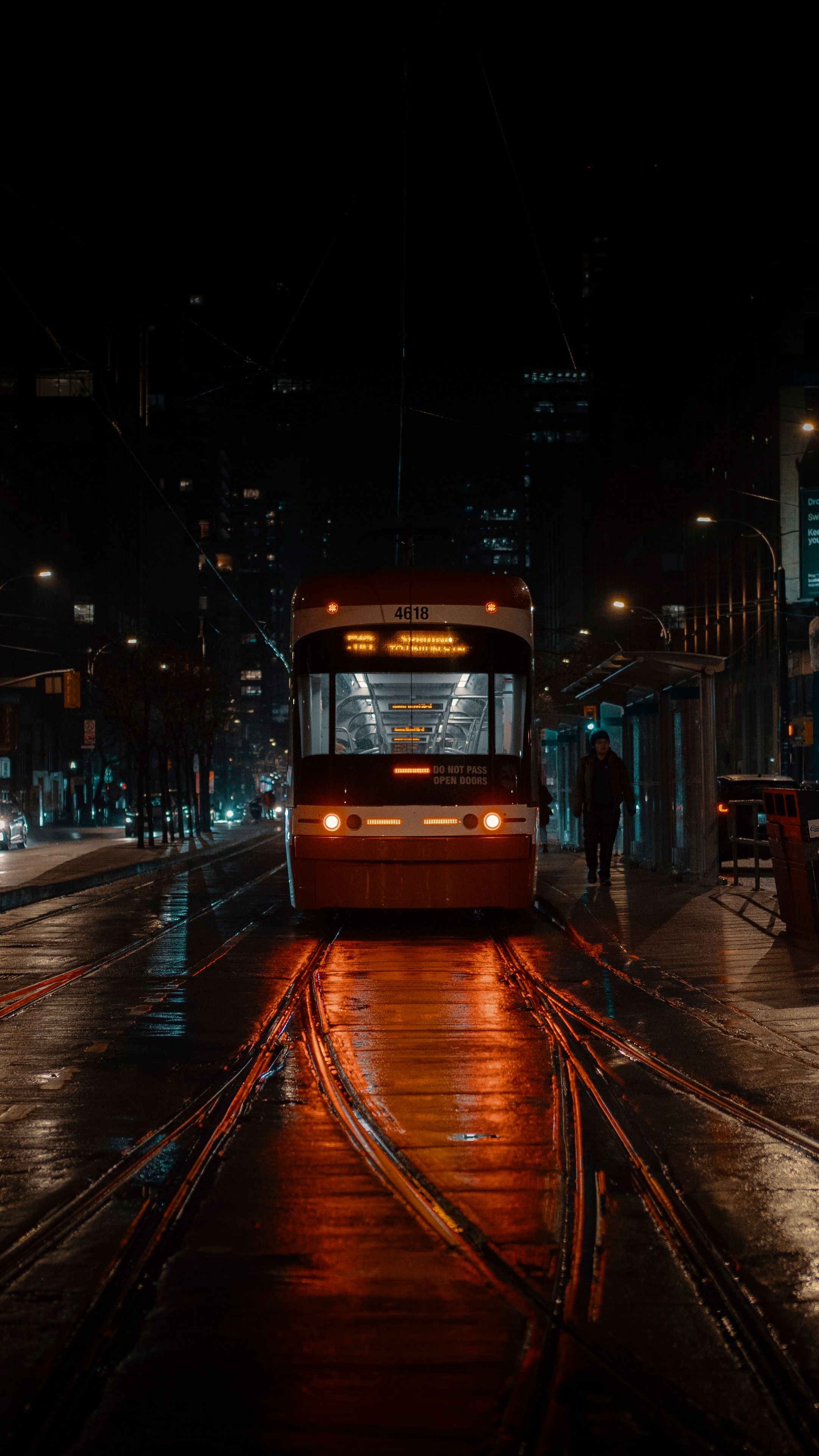 Nighttime City Streetcar Reflection Scene · Free Stock Photo