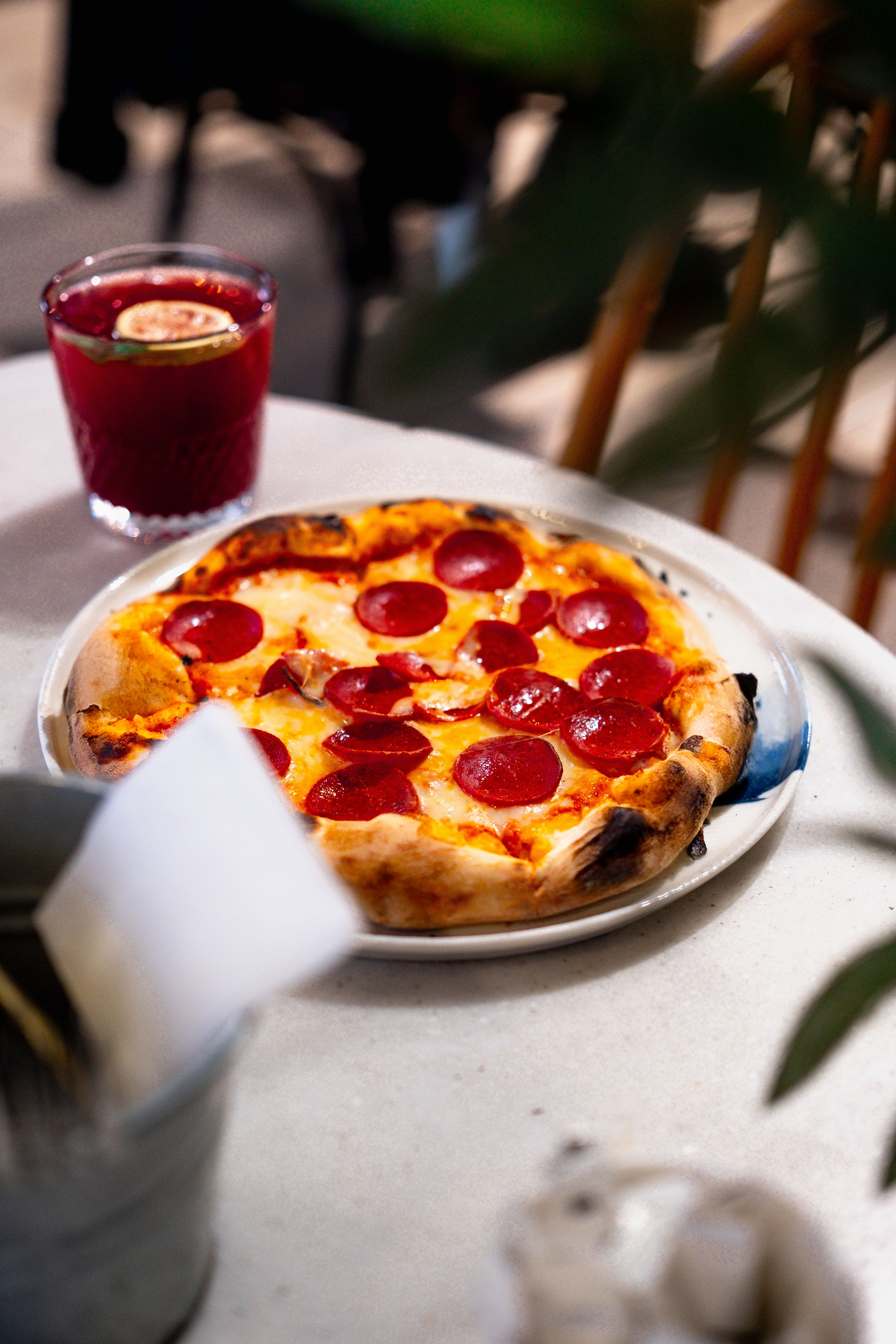 Delicious Pepperoni Pizza with Drink on Table · Free Stock Photo