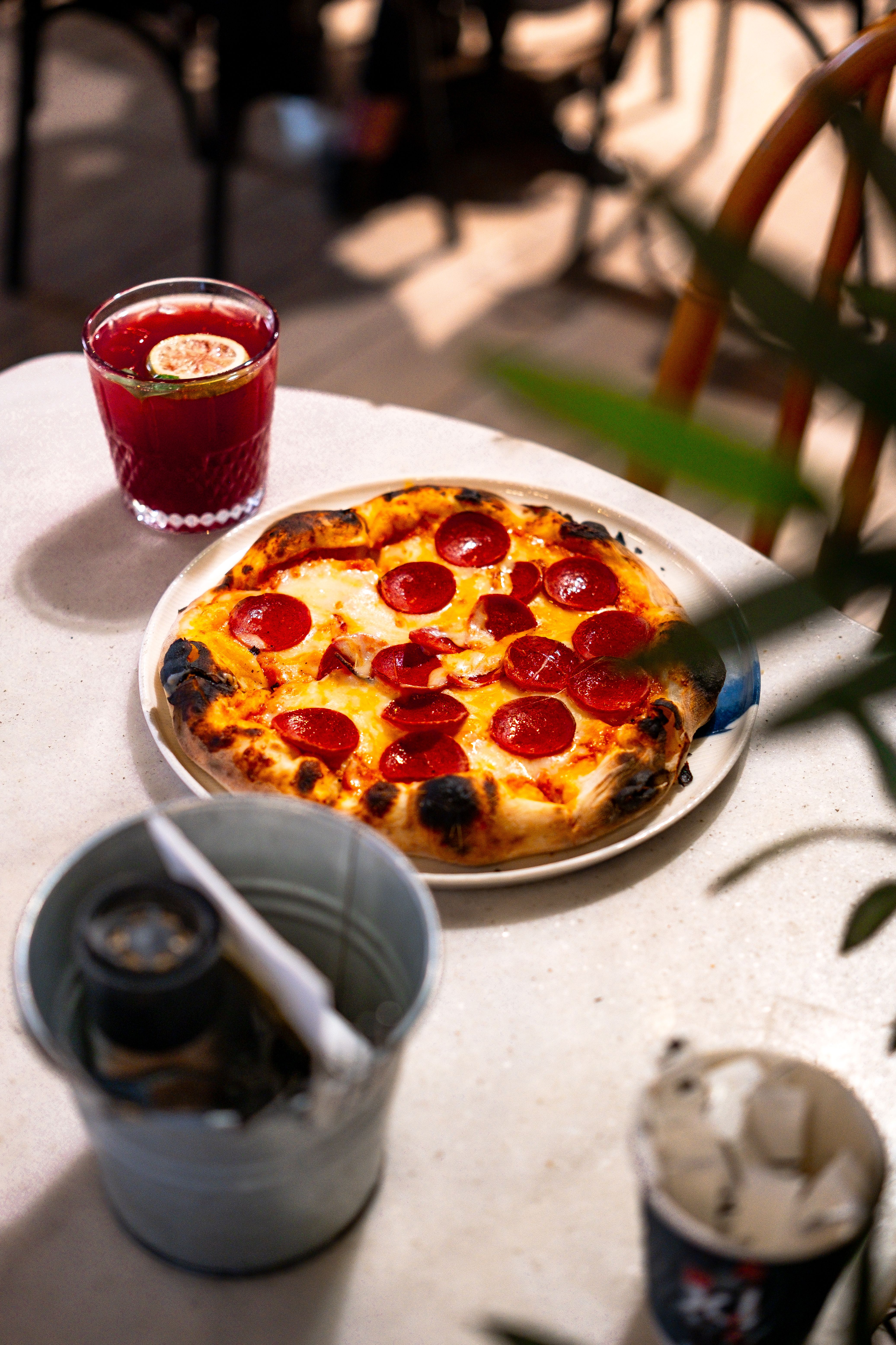 Pepperoni Pizza and Drink on Outdoor Table · Free Stock Photo