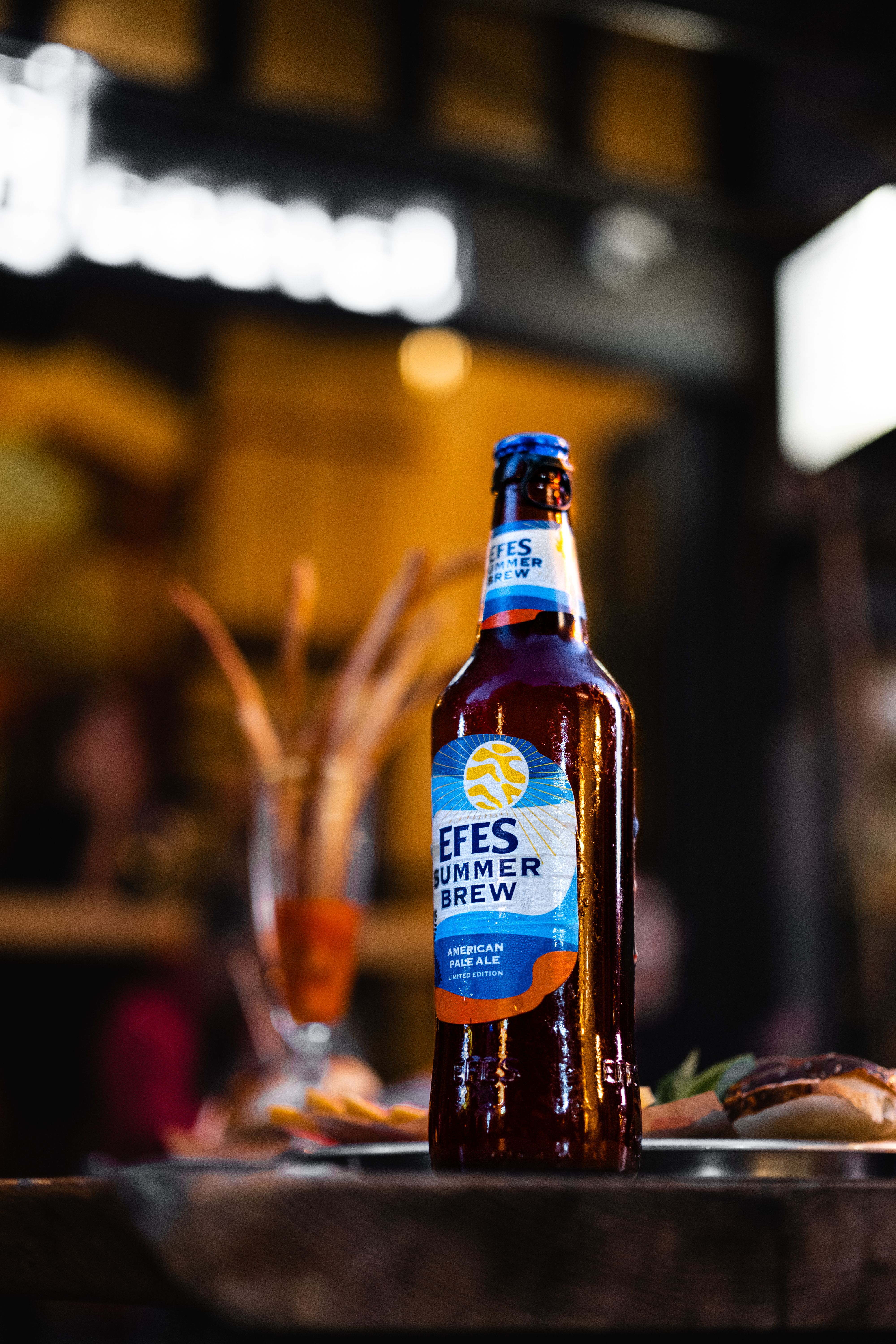 Chilled Efes Summer Brew Bottle on Table · Free Stock Photo