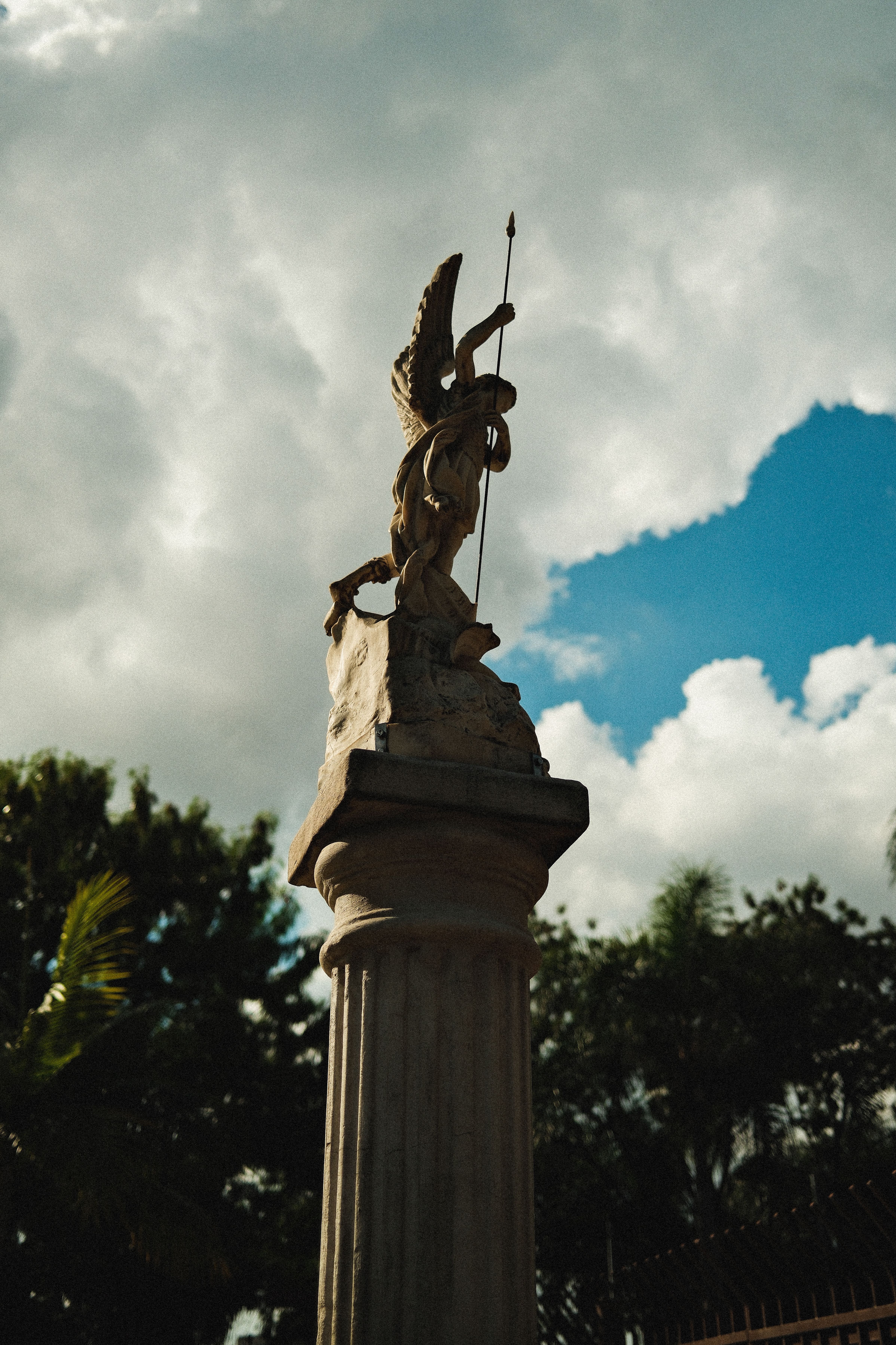 Elegant Angel Statue Against Blue Sky · Free Stock Photo