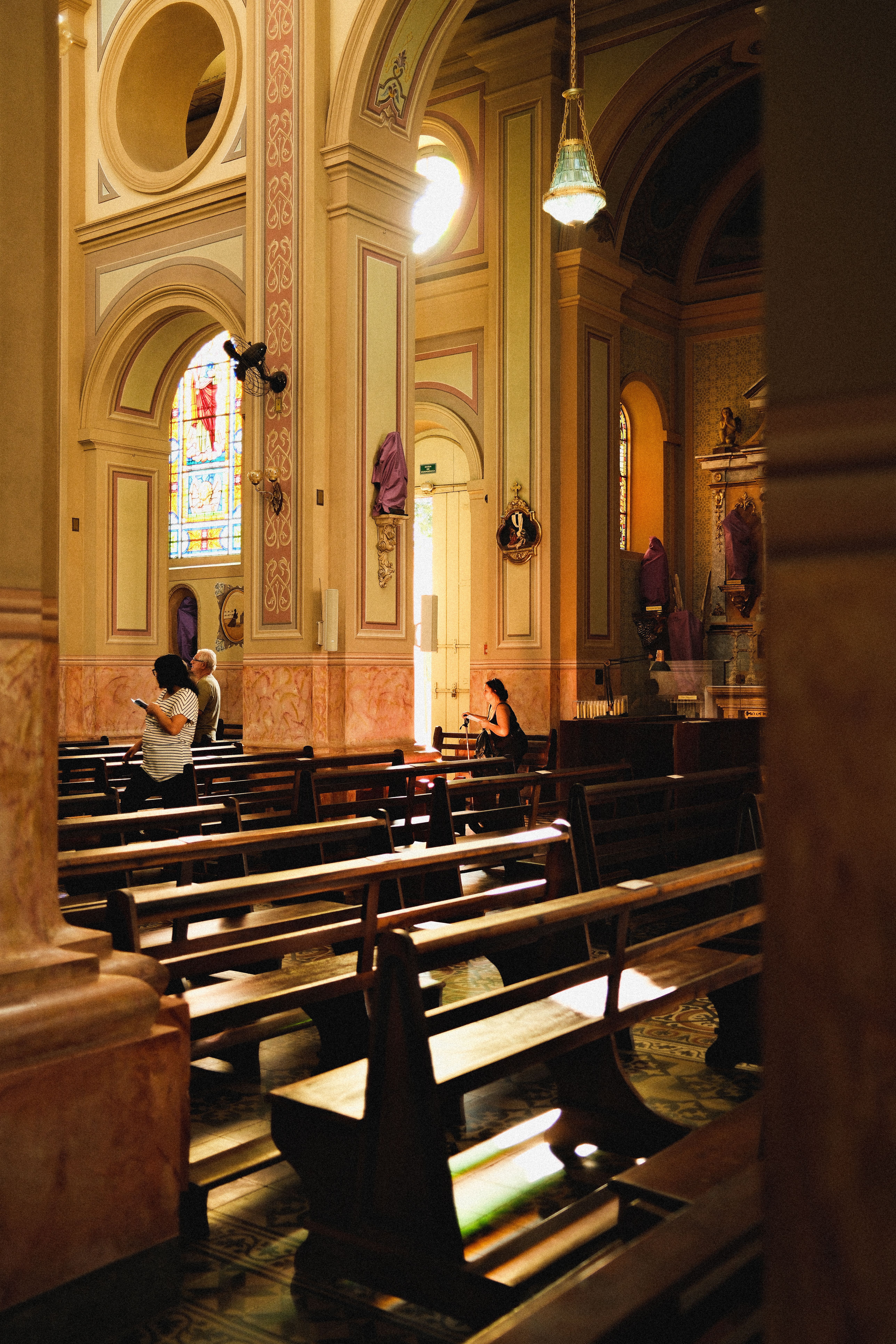 Peaceful Church Interior with Stained Glass · Free Stock Photo
