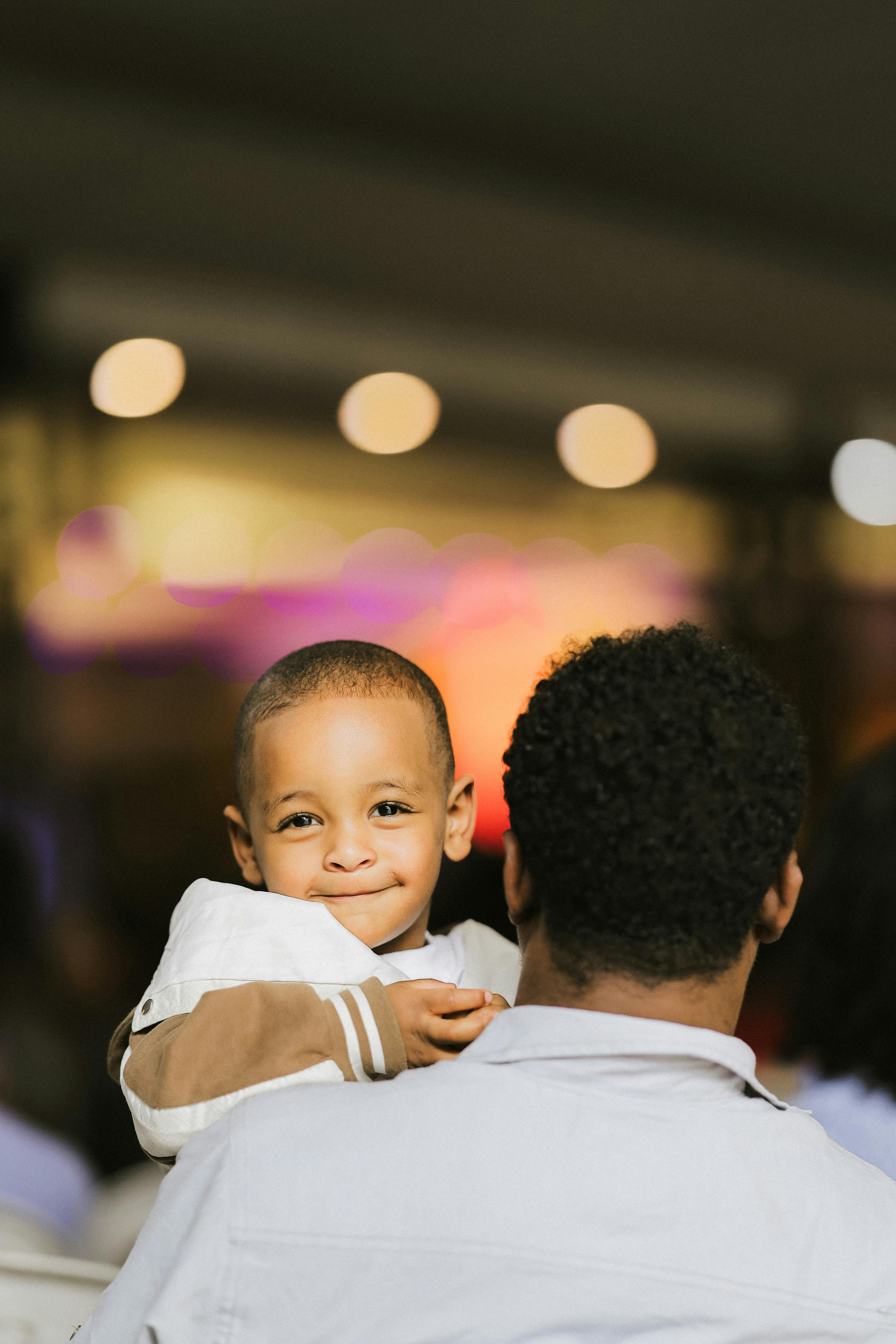 Father and Son Smiling at Event in Addis Ababa · Free Stock Photo