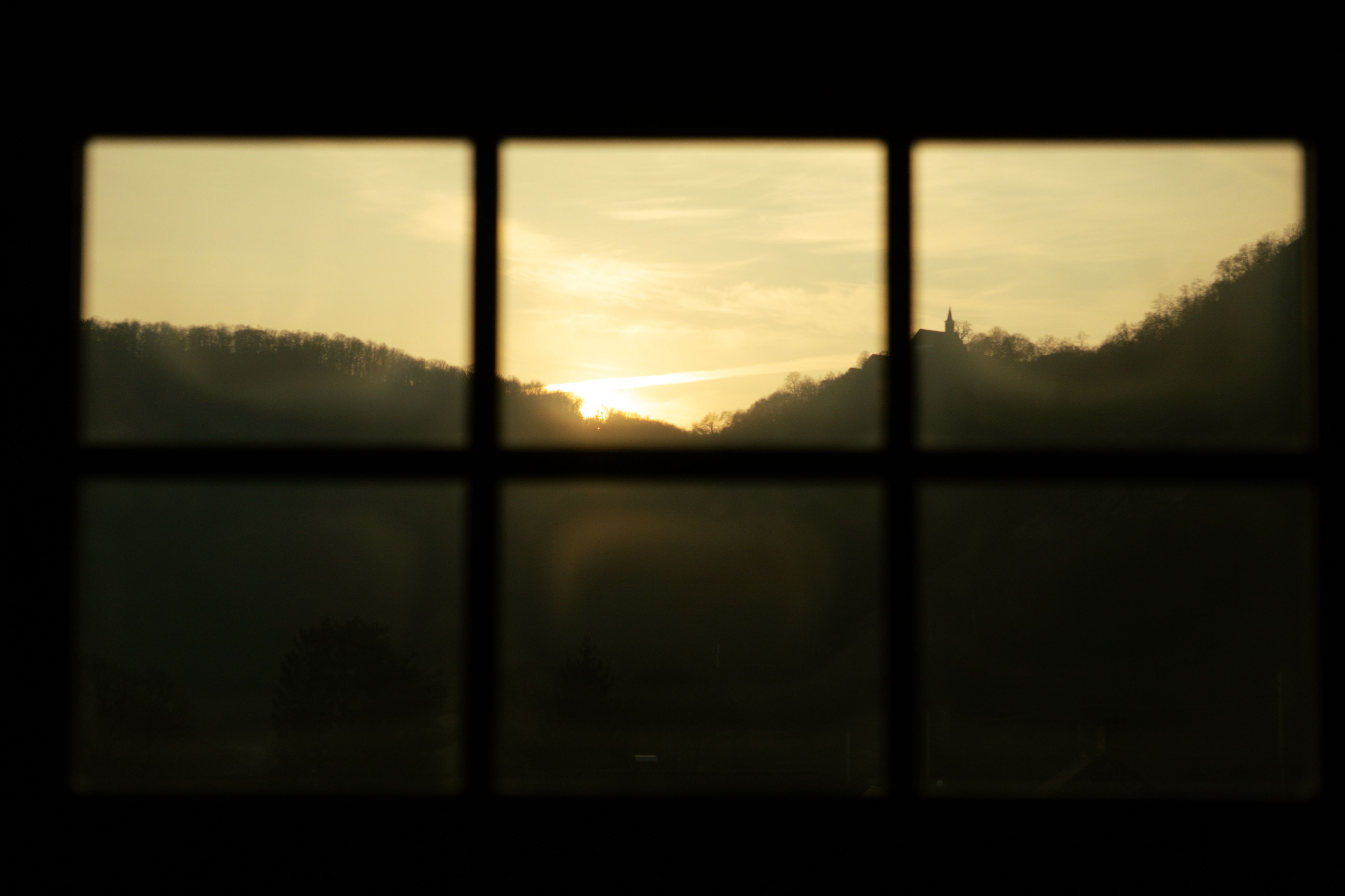 Serene Sunset View Through Window · Free Stock Photo