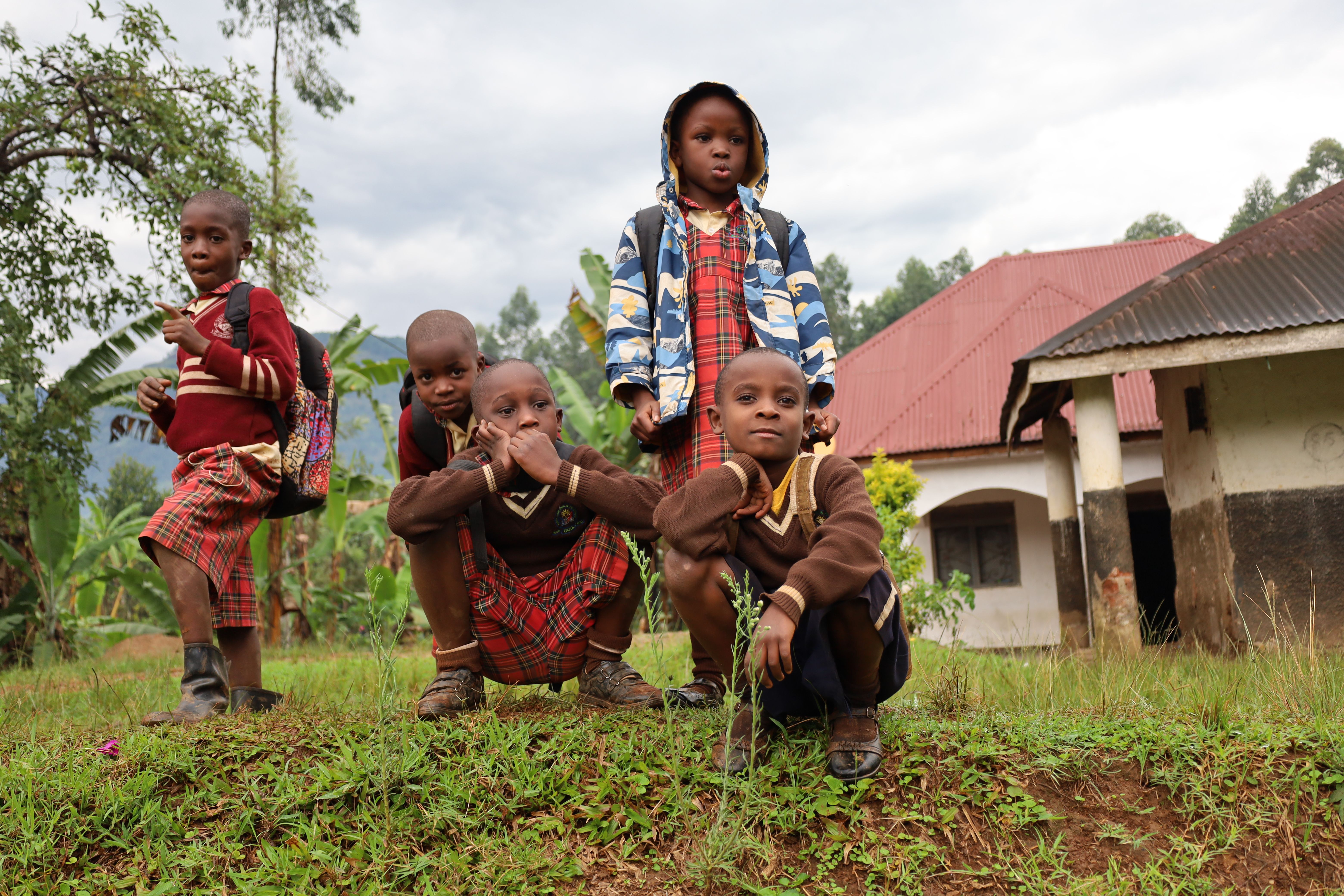 Group of Children Posing in Rural Village Setting · Free Stock Photo