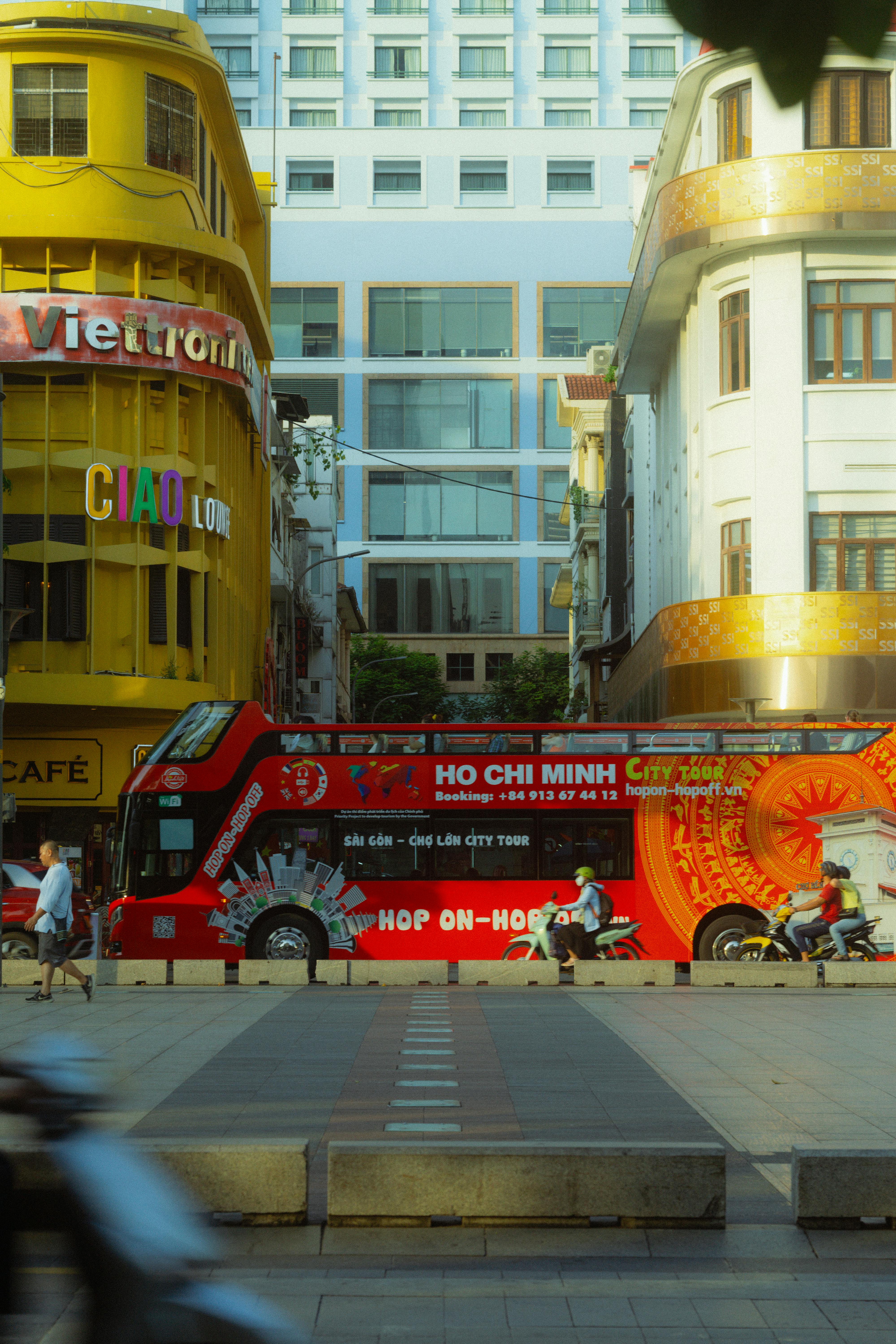Colorful Ho Chi Minh City Tour Bus on Street · Free Stock Photo