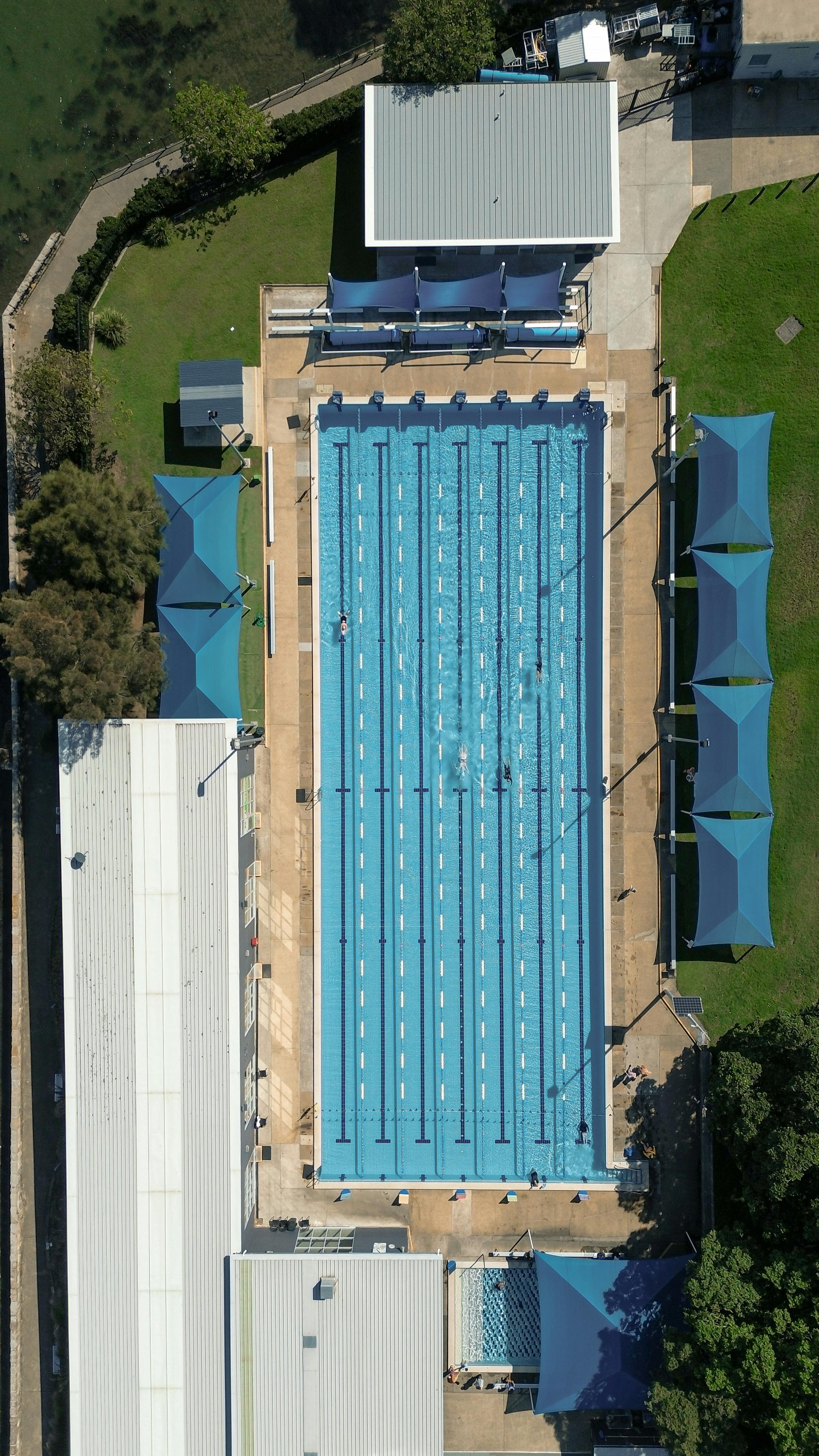 Aerial View of Outdoor Olympic Swimming Pool · Free Stock Photo