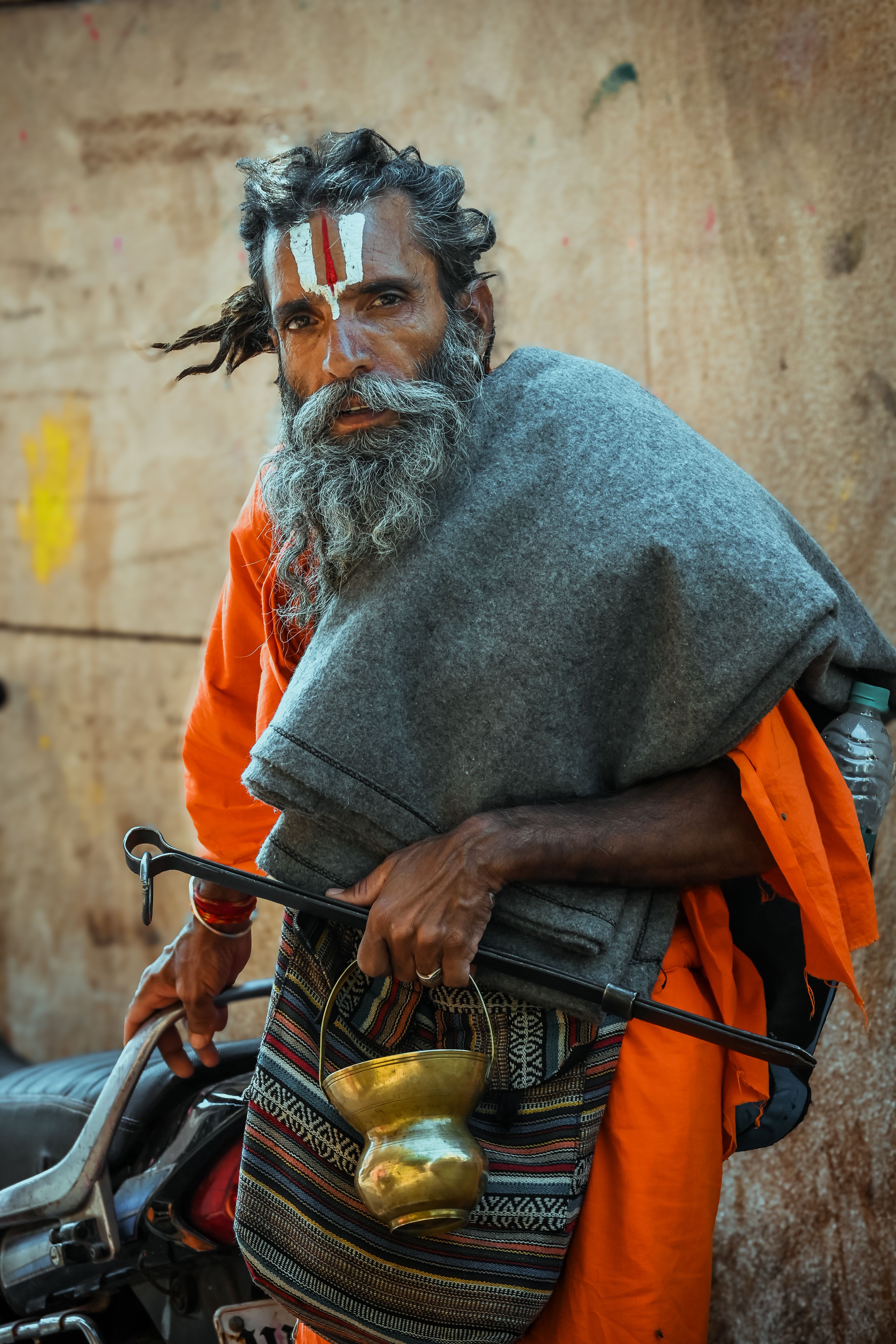 Holy Man in Traditional Attire on Varanasi Street · Free Stock Photo