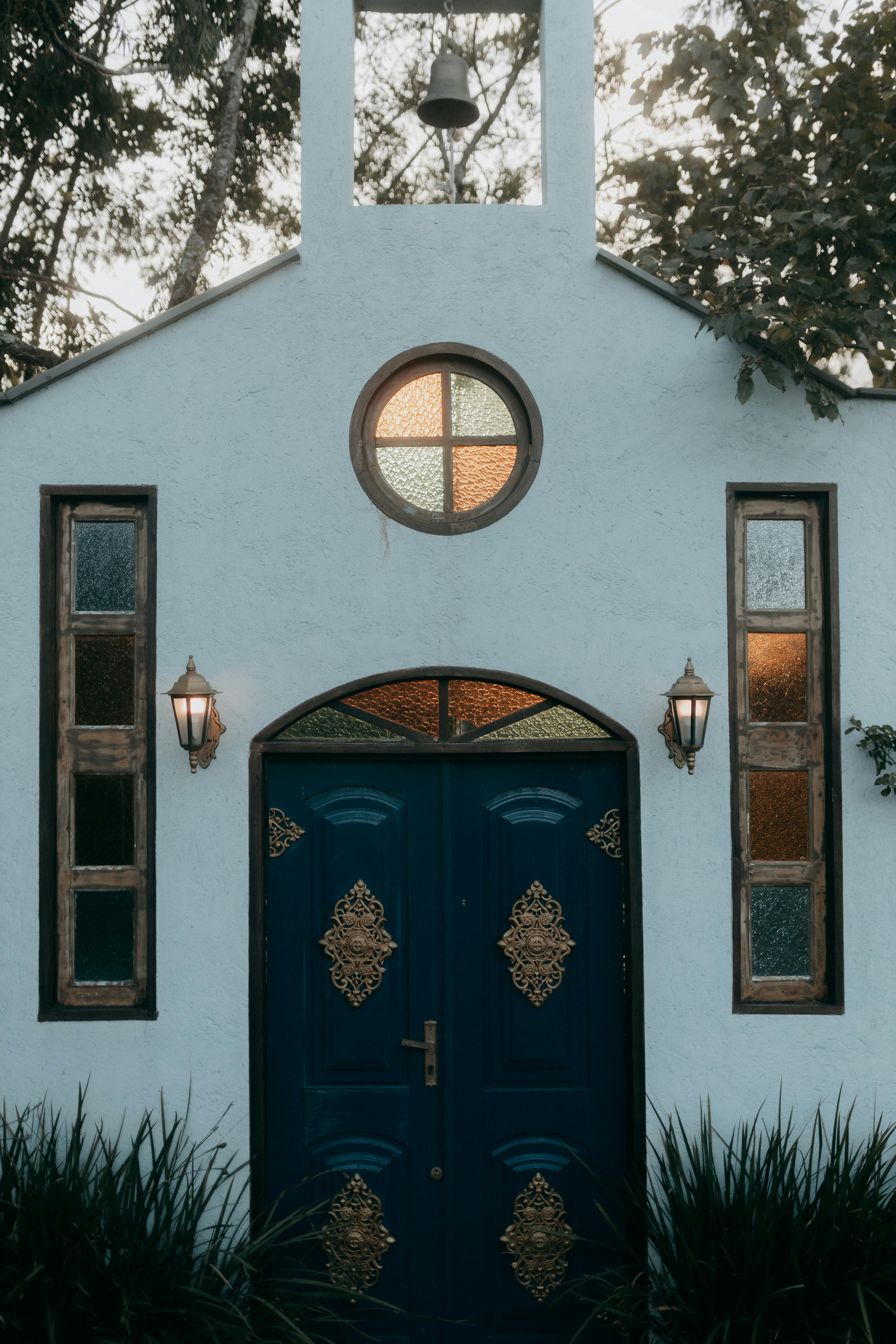 Charming Rustic Chapel Entrance at Dusk · Free Stock Photo
