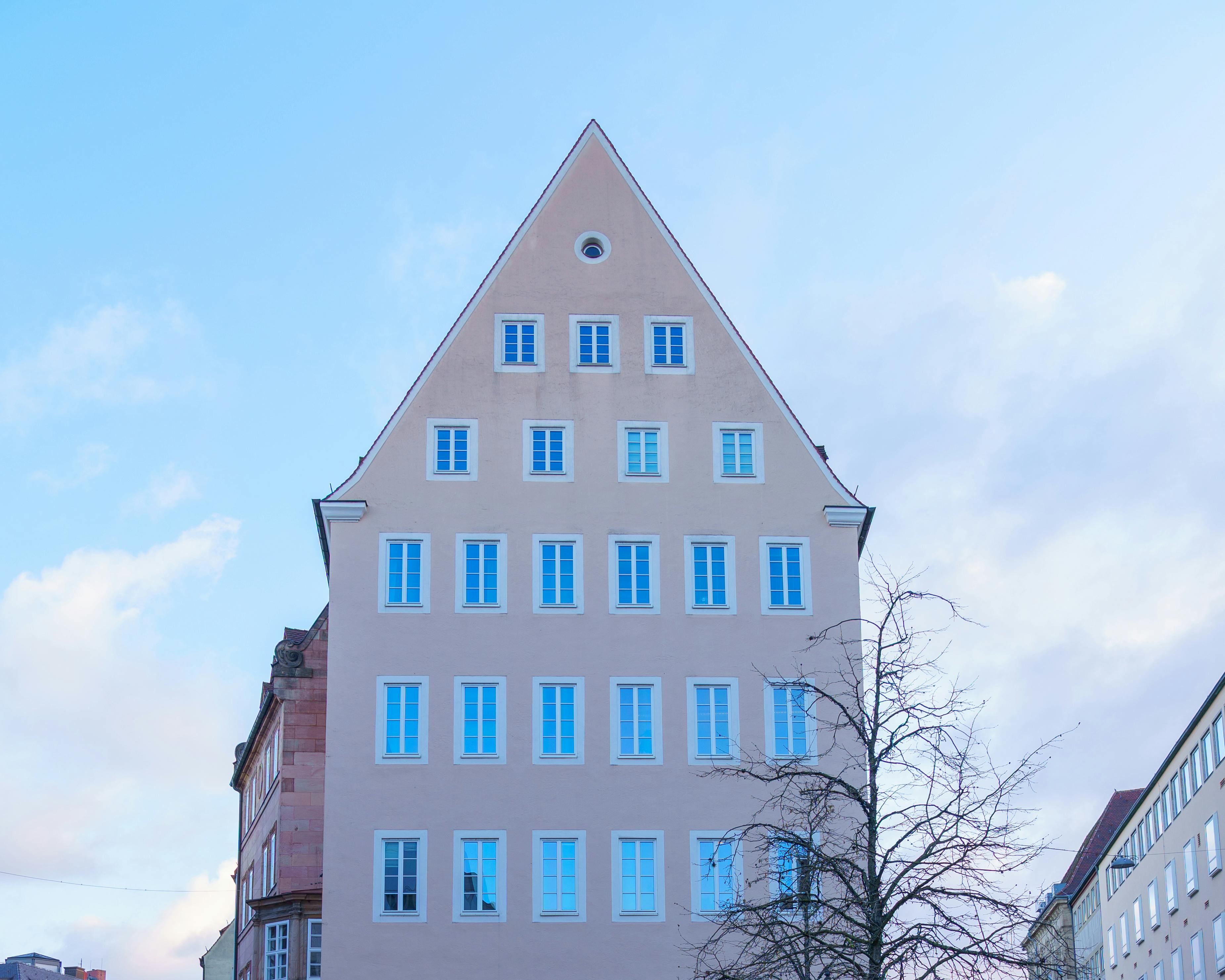 Triangular Architectural Facade in Urban Setting · Free Stock Photo