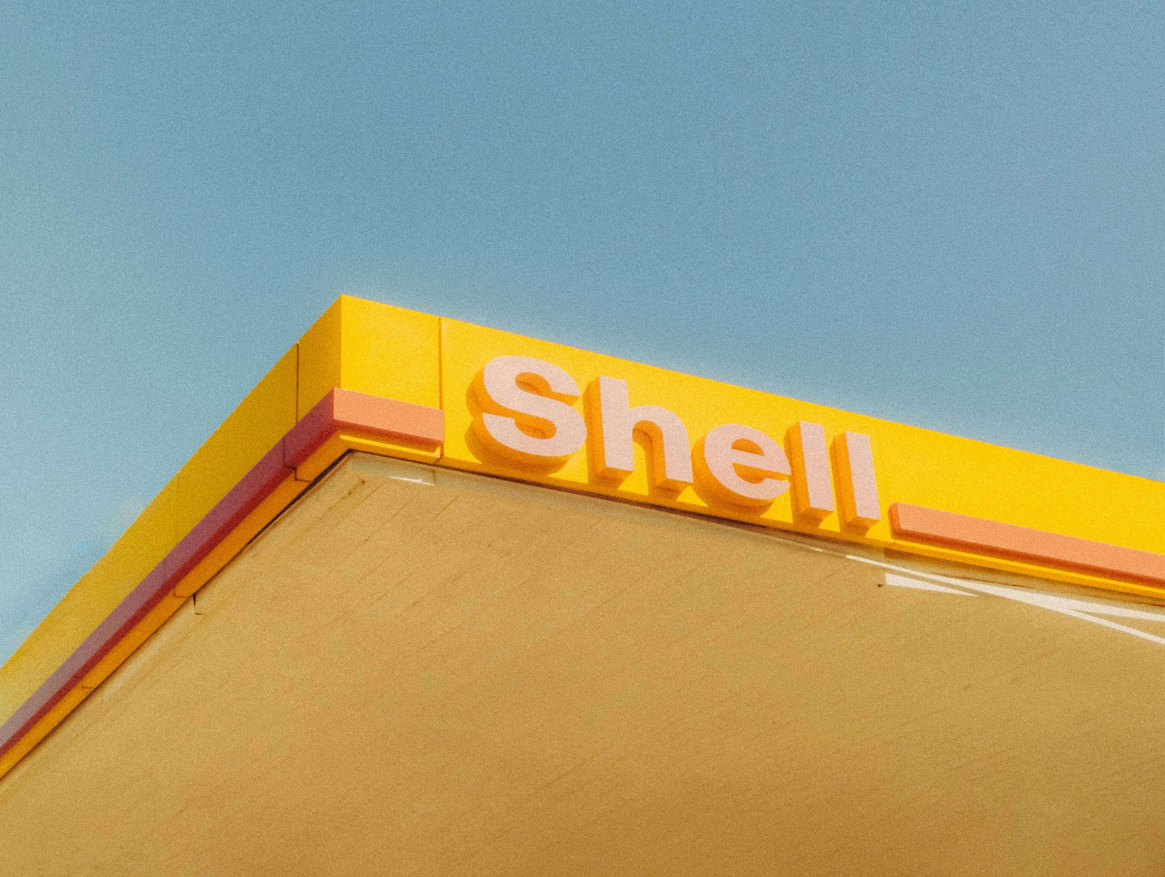 Minimalist Shell Gas Station Under Blue Sky · Free Stock Photo