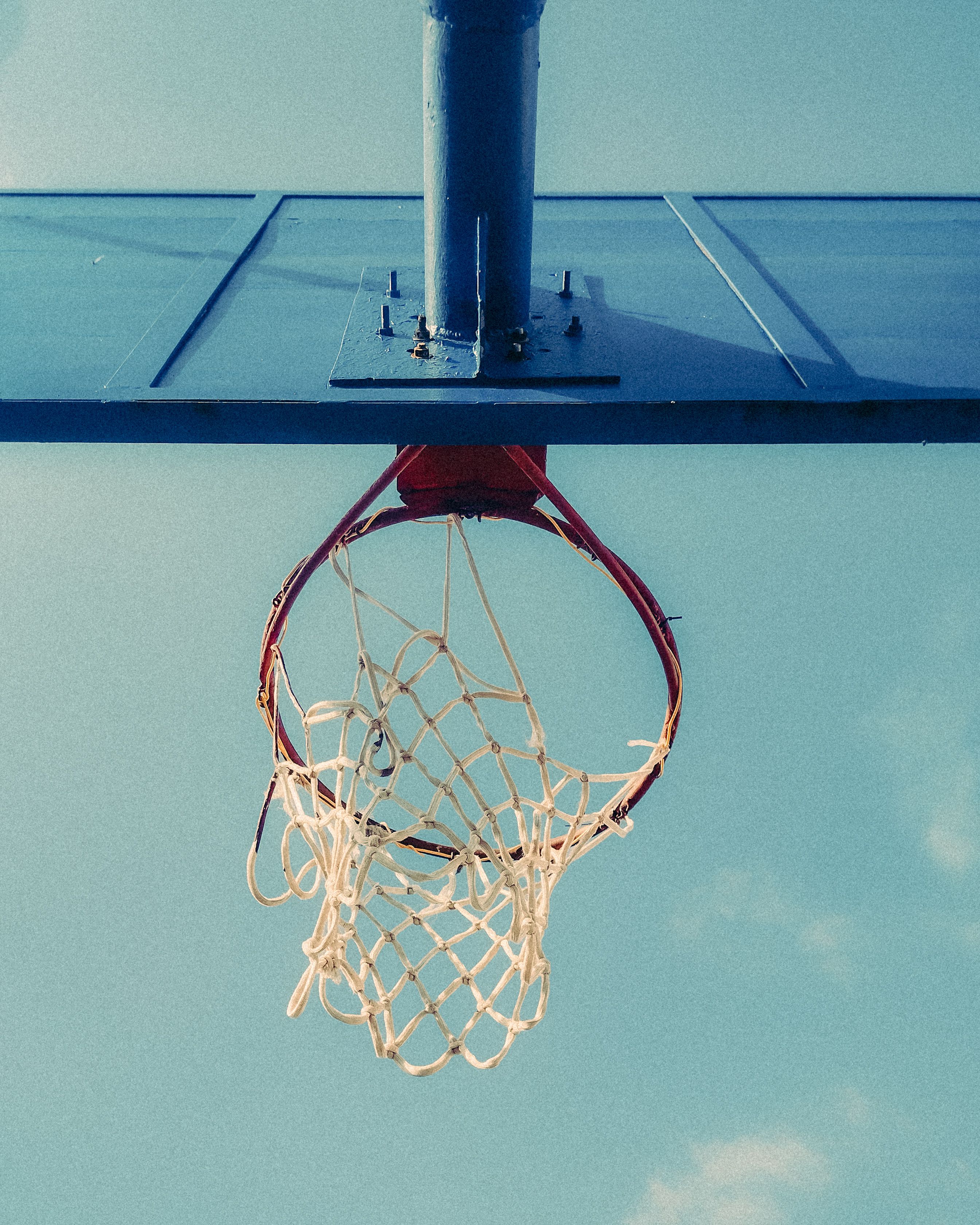 Outdoor Basketball Hoop under Clear Blue Sky · Free Stock Photo