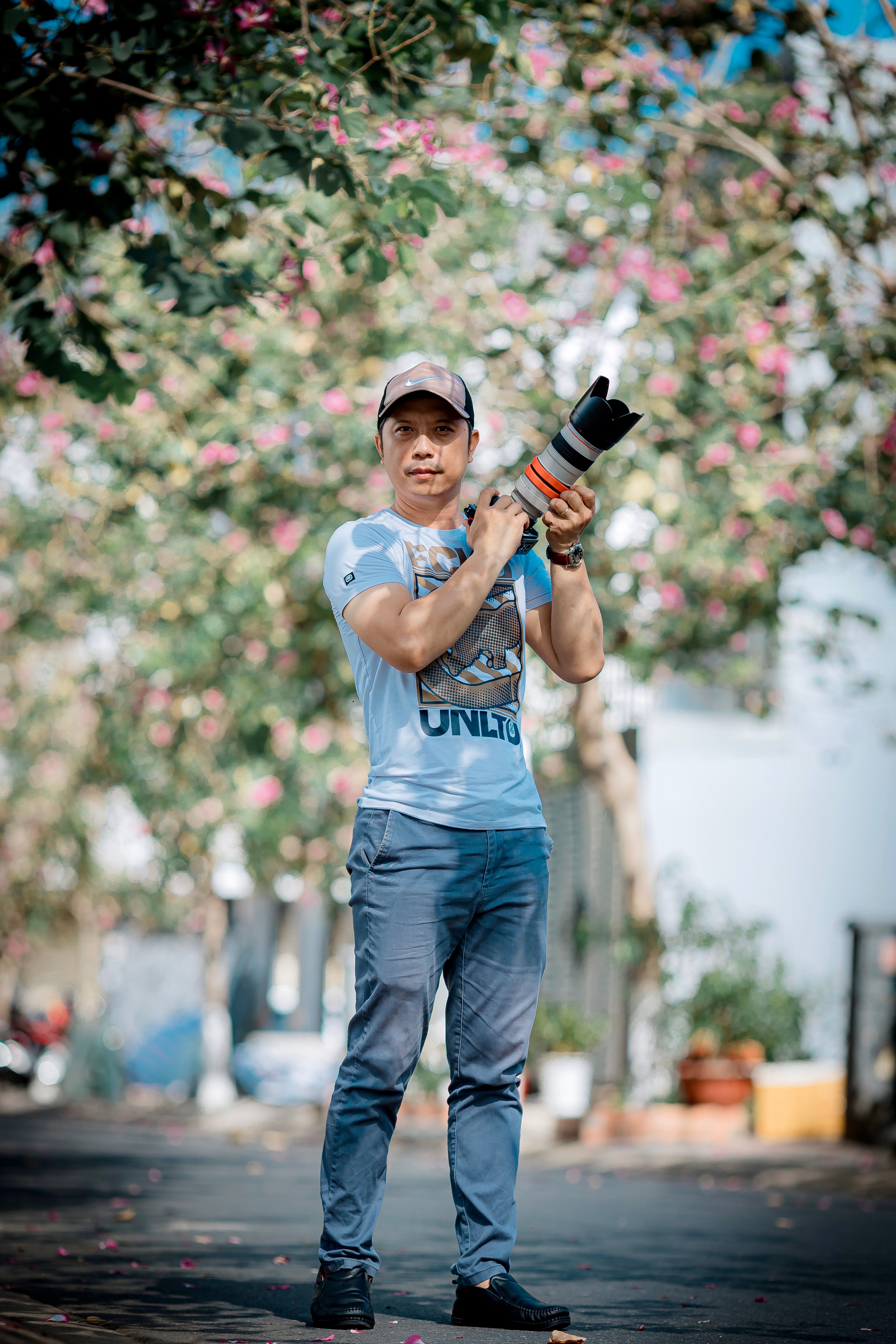 Man with Camera in Blooming Street Photography · Free Stock Photo