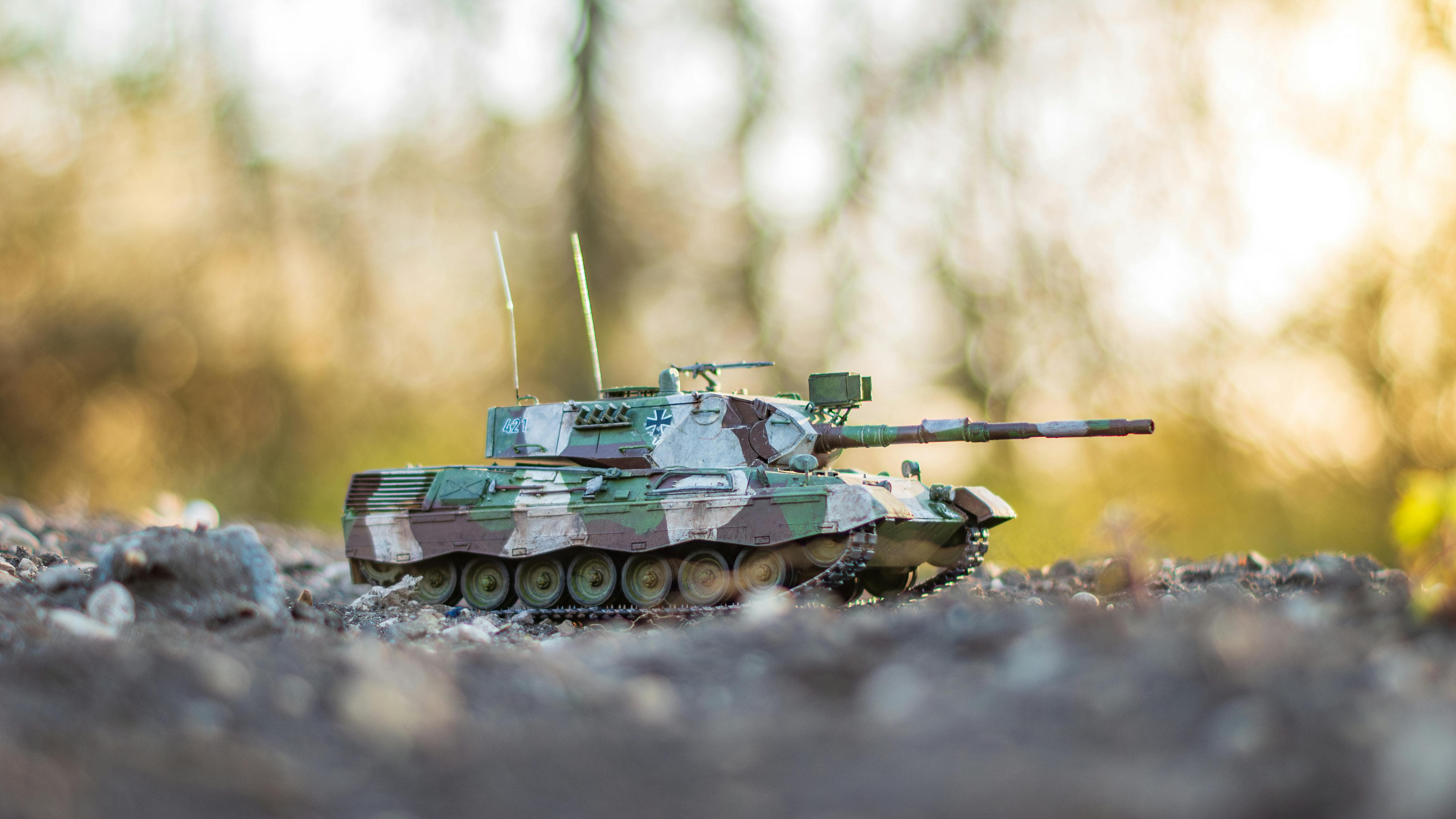 Miniature Military Tank Model Outdoors in Nature · Free Stock Photo