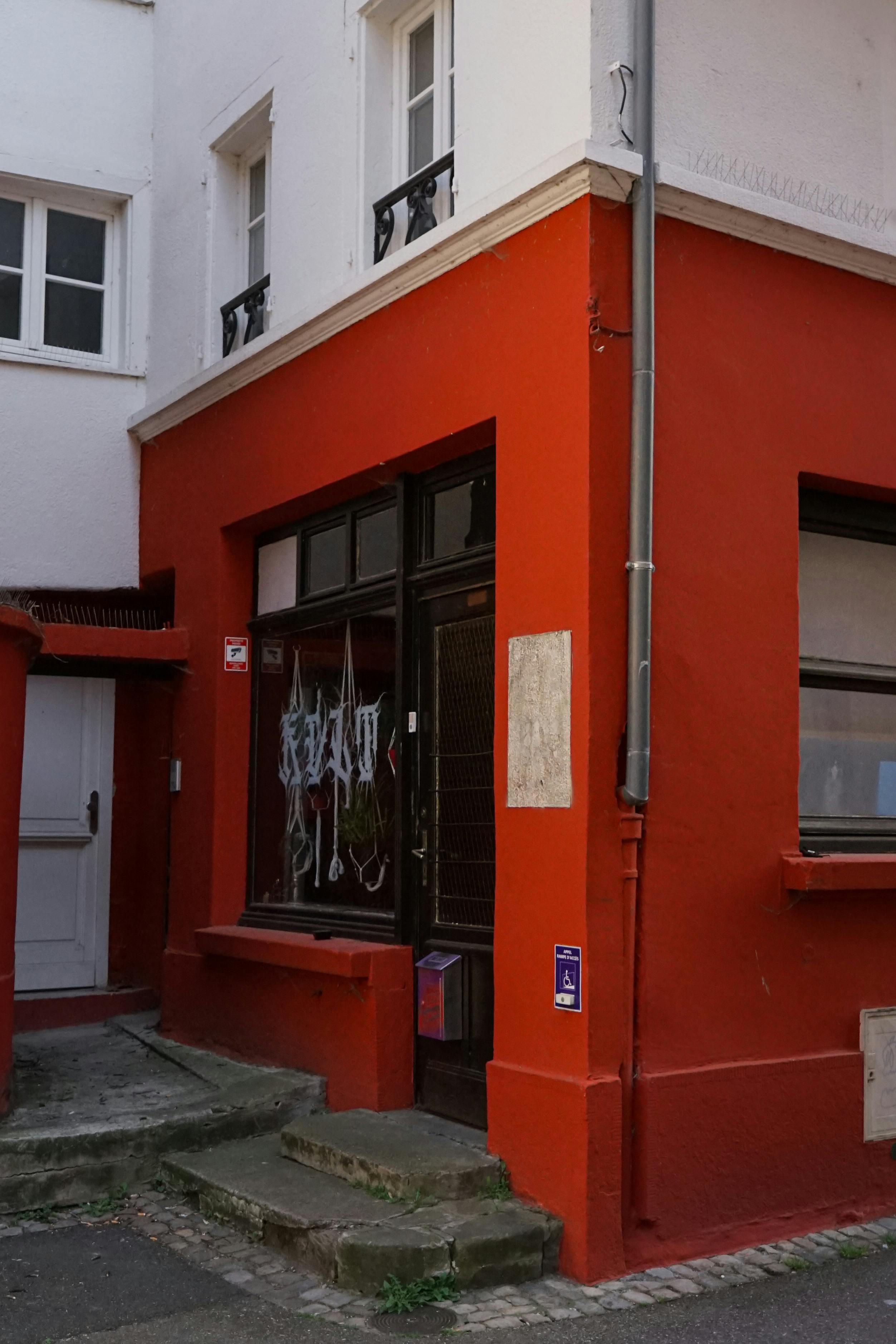 Bright Red Building Corner in Urban Setting · Free Stock Photo