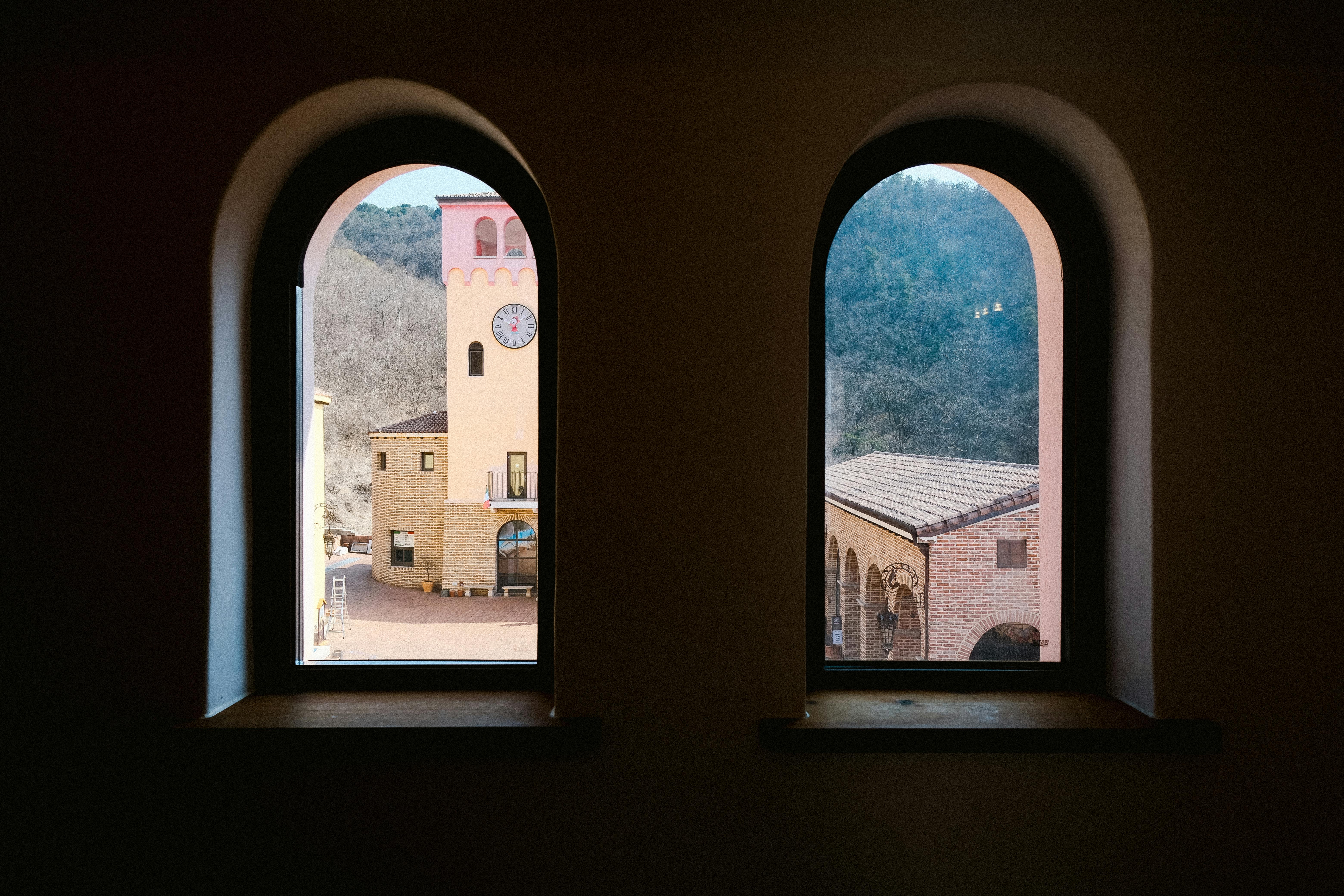 Arched Window View of Mediterranean Architecture · Free Stock Photo