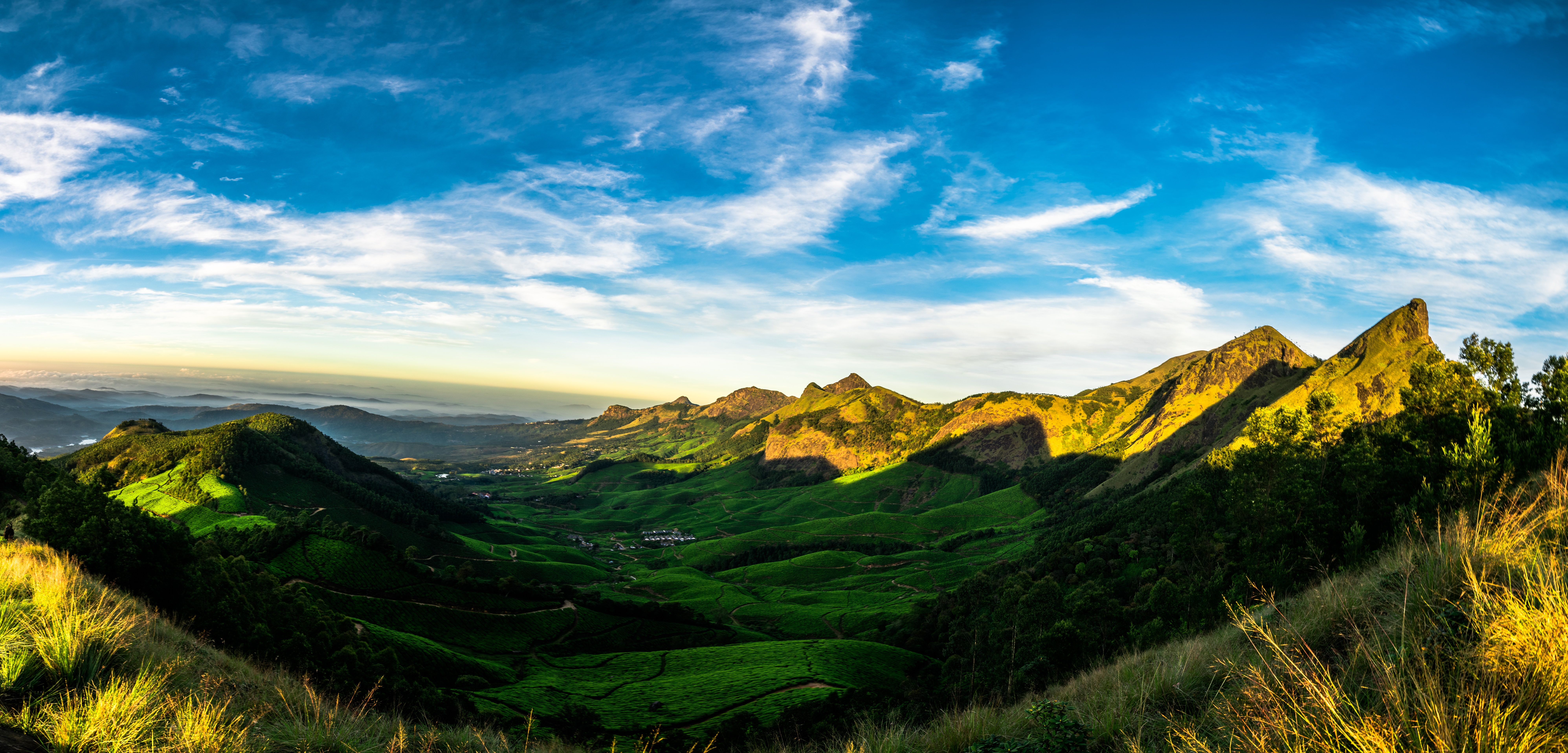 Scenic View of Mountains Against Cloudy Sky · Free Stock Photo