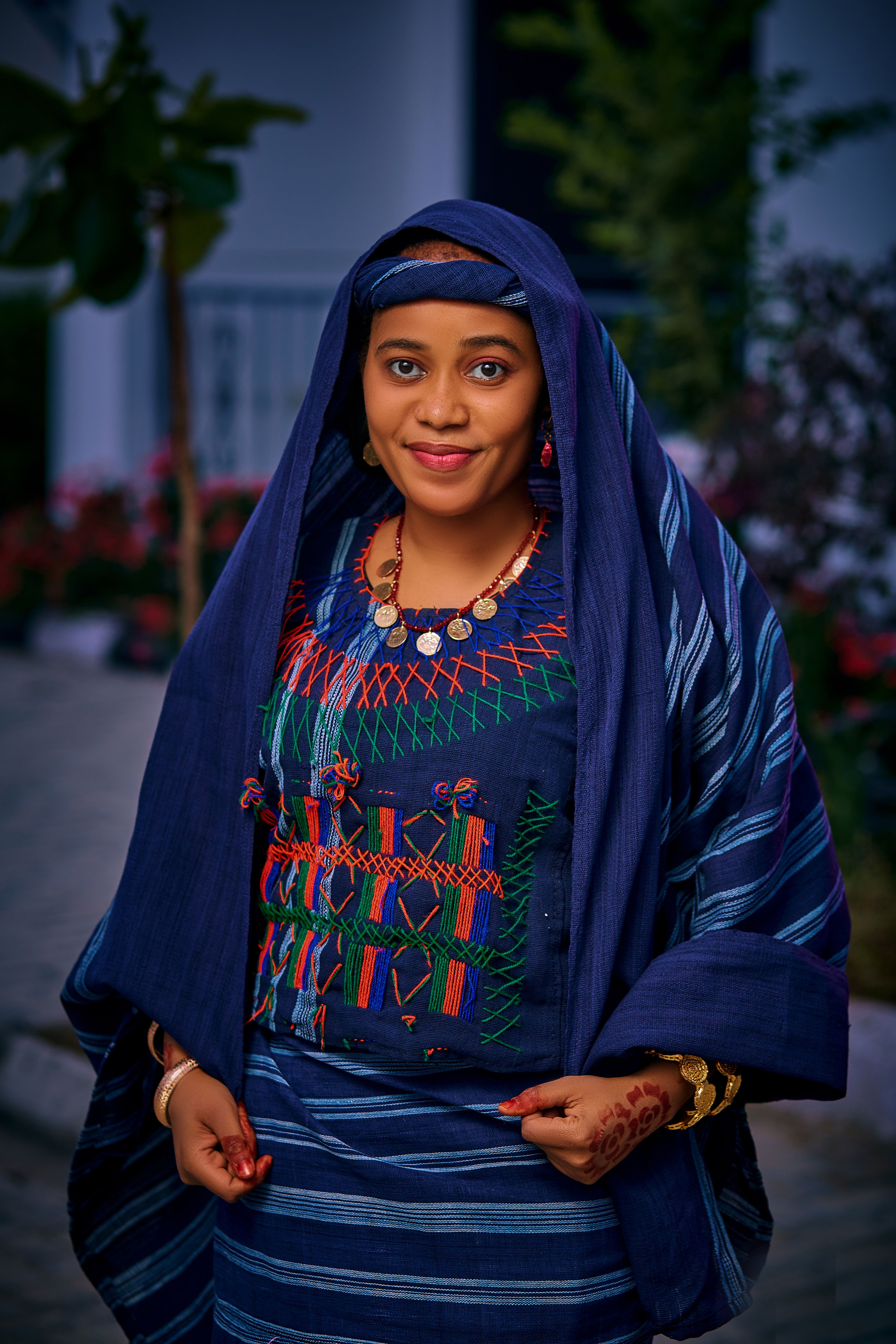 Elegant Woman in Traditional Blue Attire · Free Stock Photo