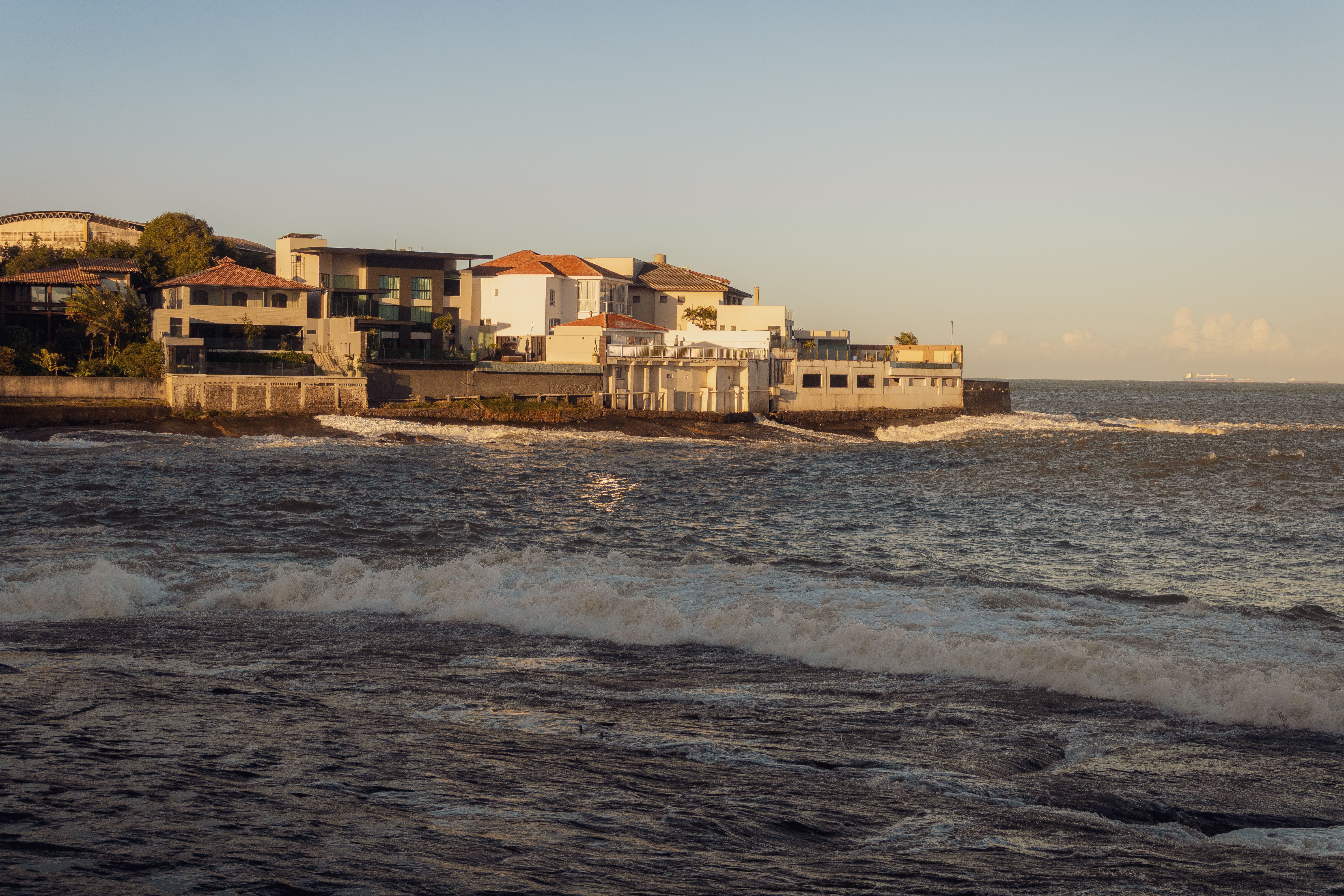 Coastal Buildings by the Shore during Daytime · Free Stock Photo