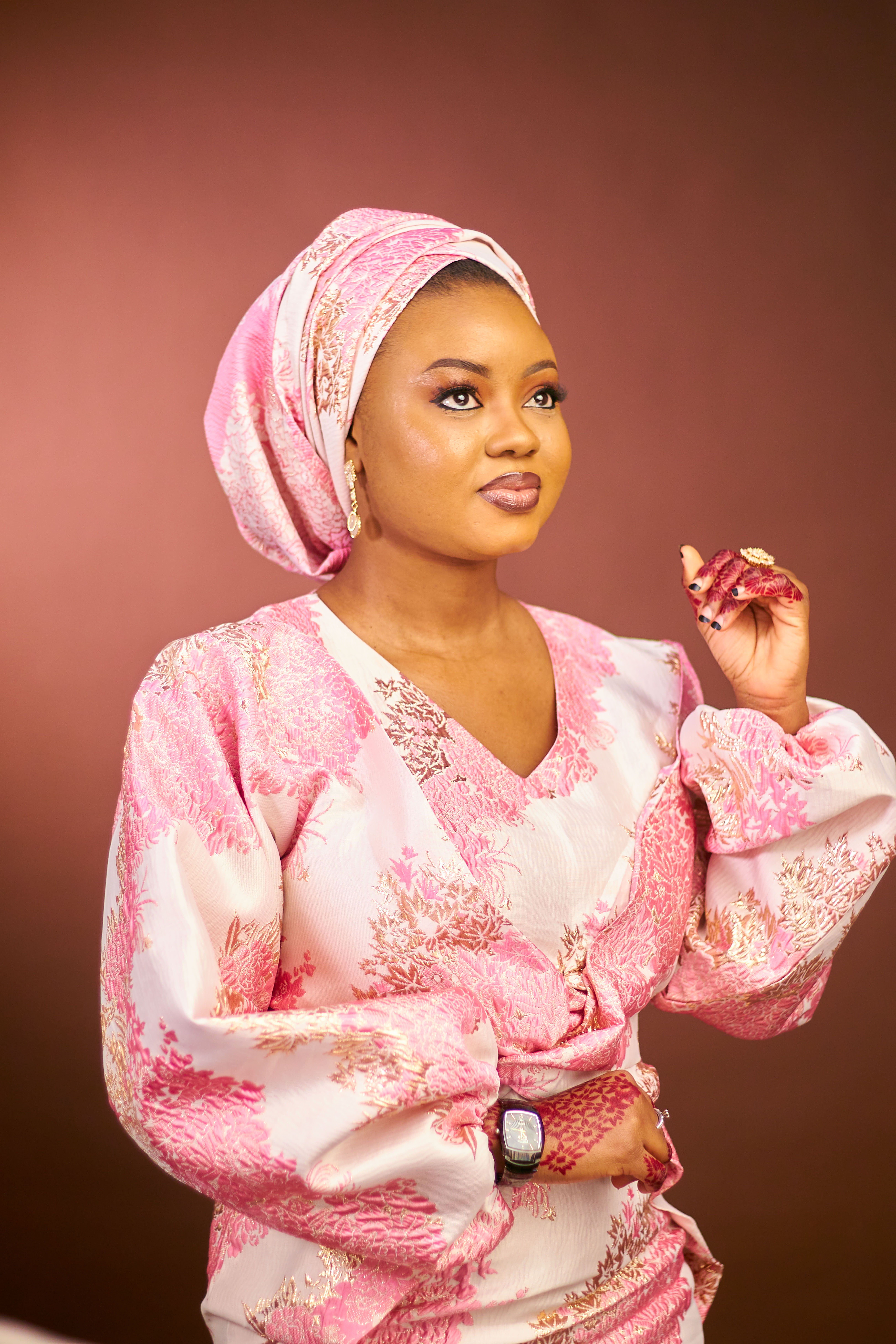 Elegant Woman in Traditional Pink African Attire · Free Stock Photo