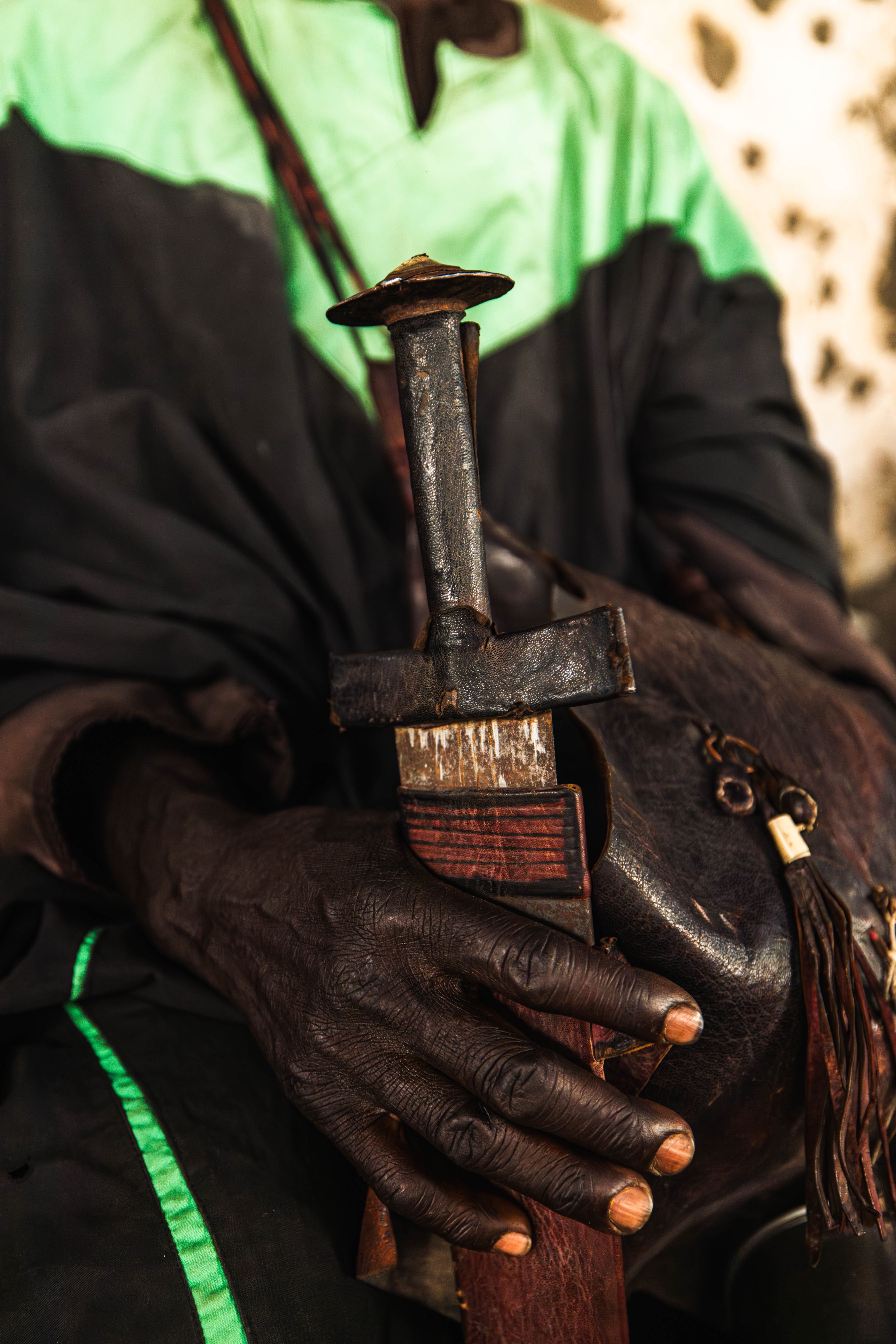 Close-up of Hands Holding Traditional Sword · Free Stock Photo