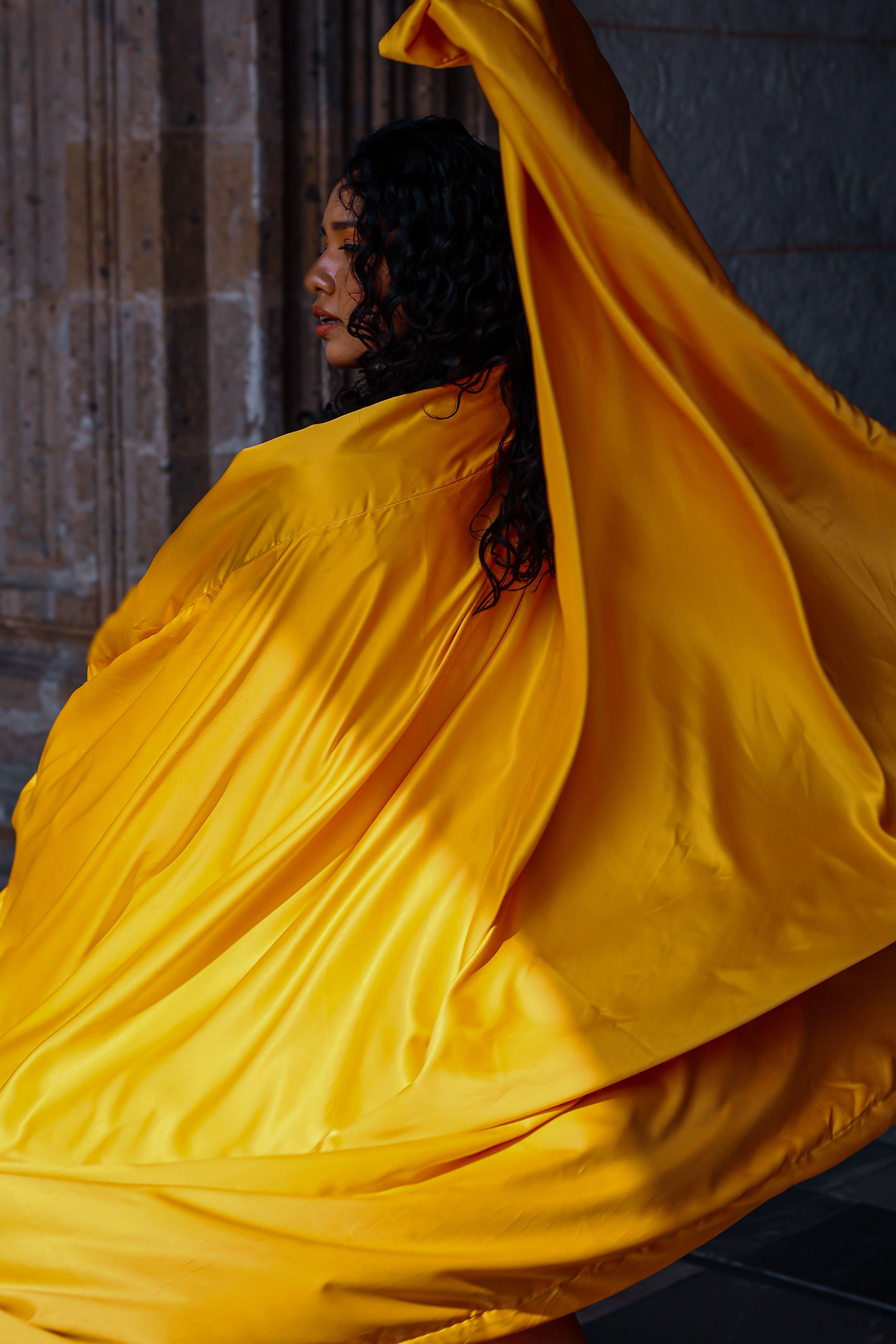 Dramatic Portrait of Woman in Flowing Yellow Fabric · Free Stock Photo