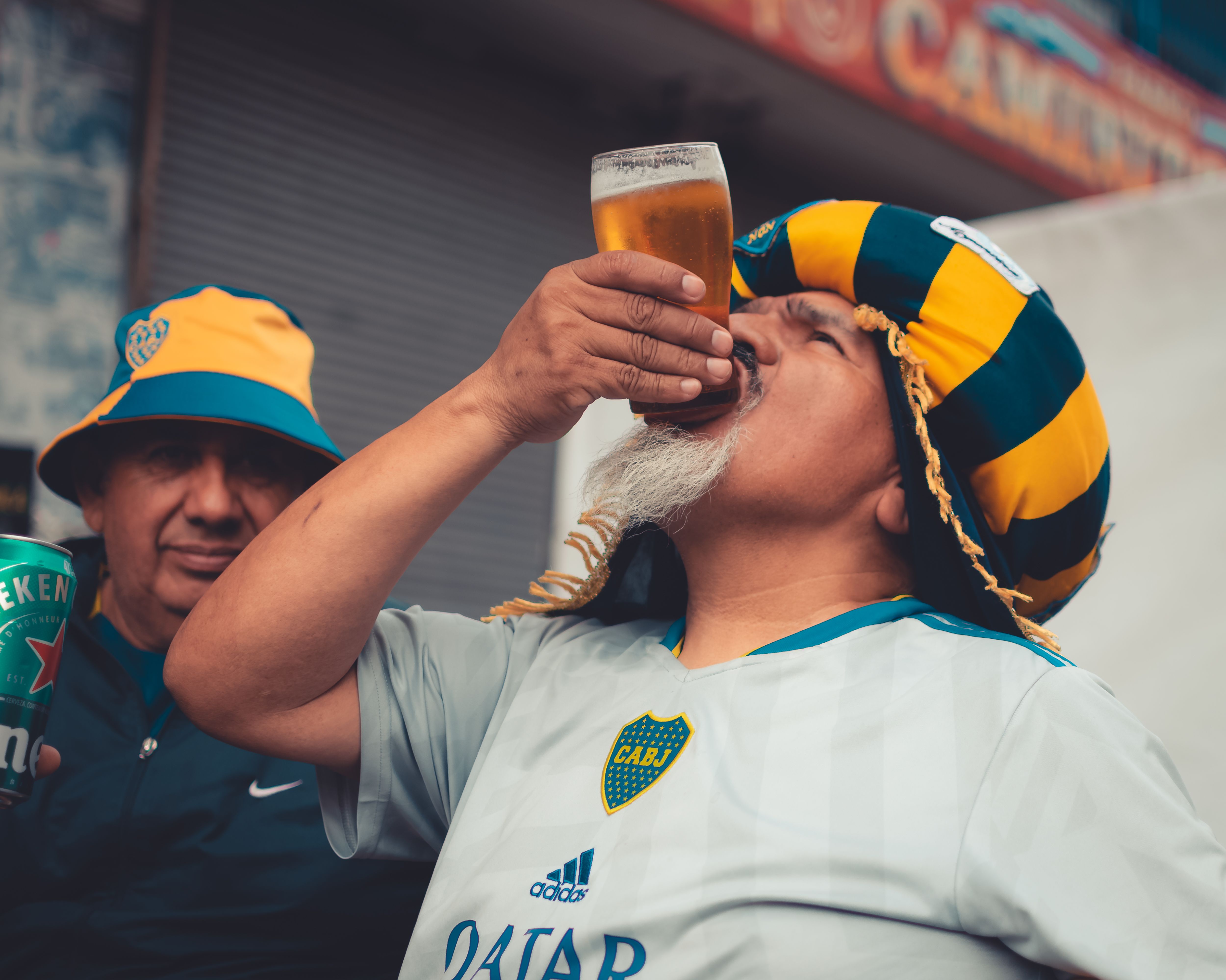 Fan Celebrating with Beer at Soccer Match · Free Stock Photo