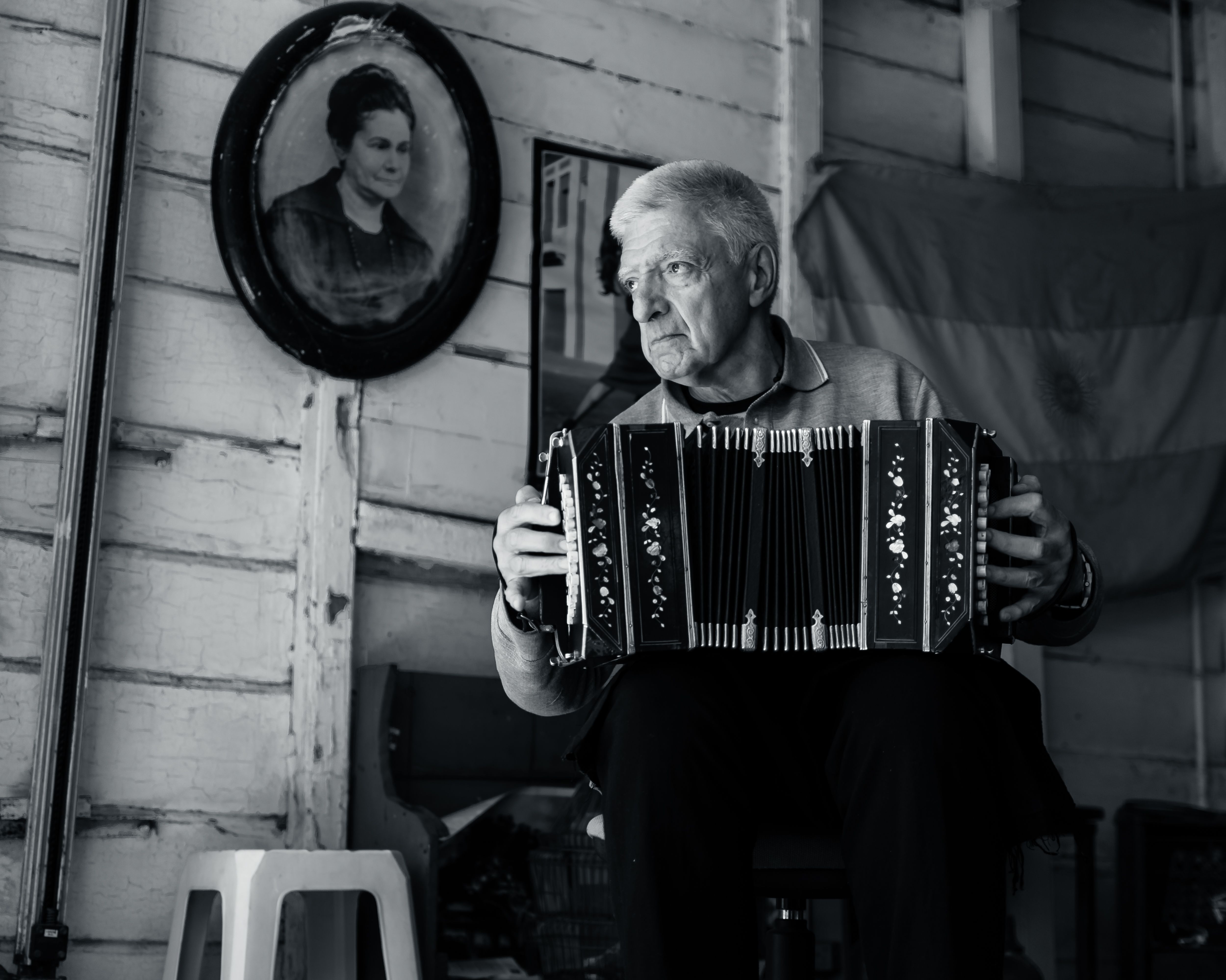 Elderly Musician Playing Bandoneon Indoors · Free Stock Photo