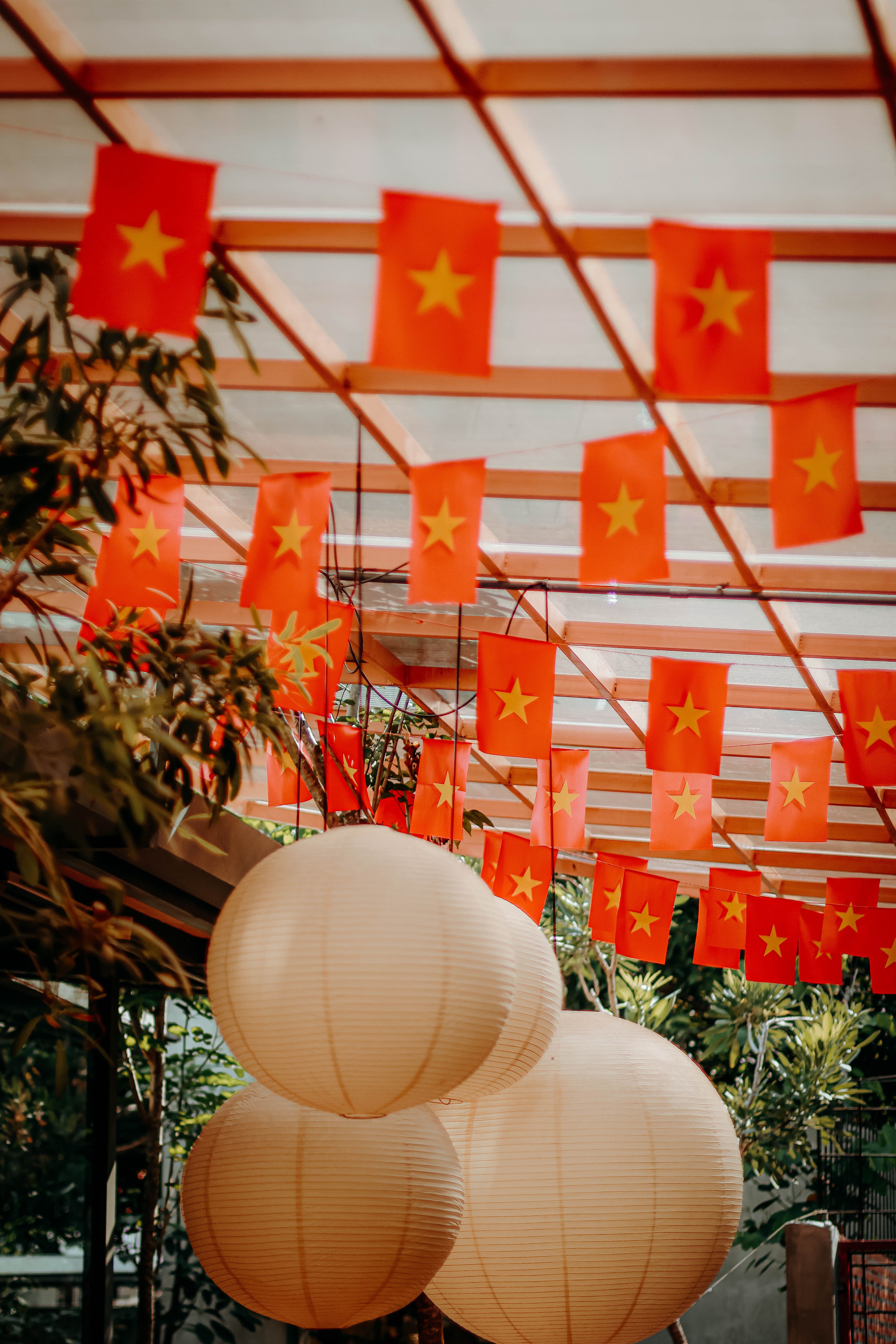 Colorful Vietnamese Lanterns and Flags Display · Free Stock Photo