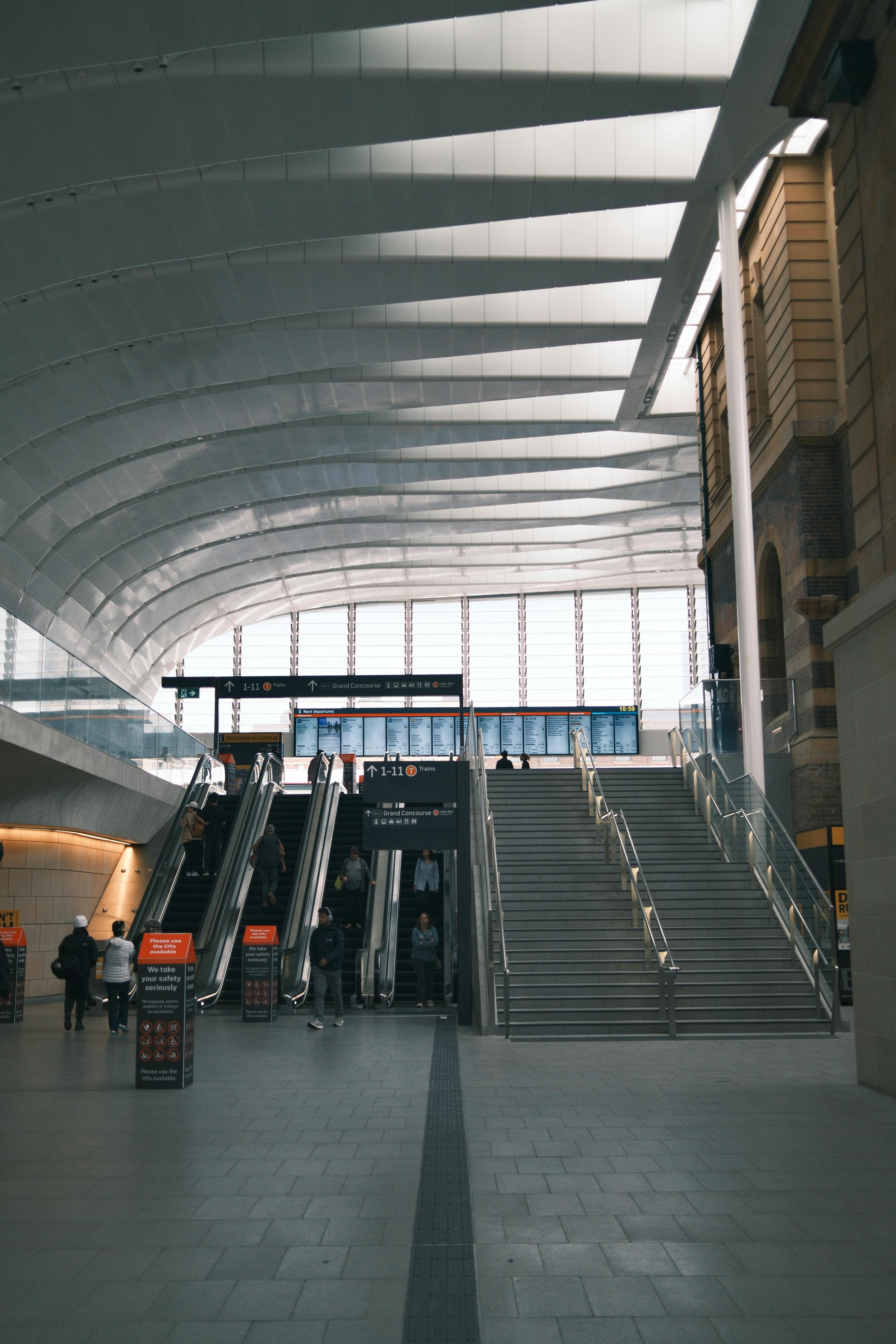 Modern Train Station Interior with Escalators · Free Stock Photo