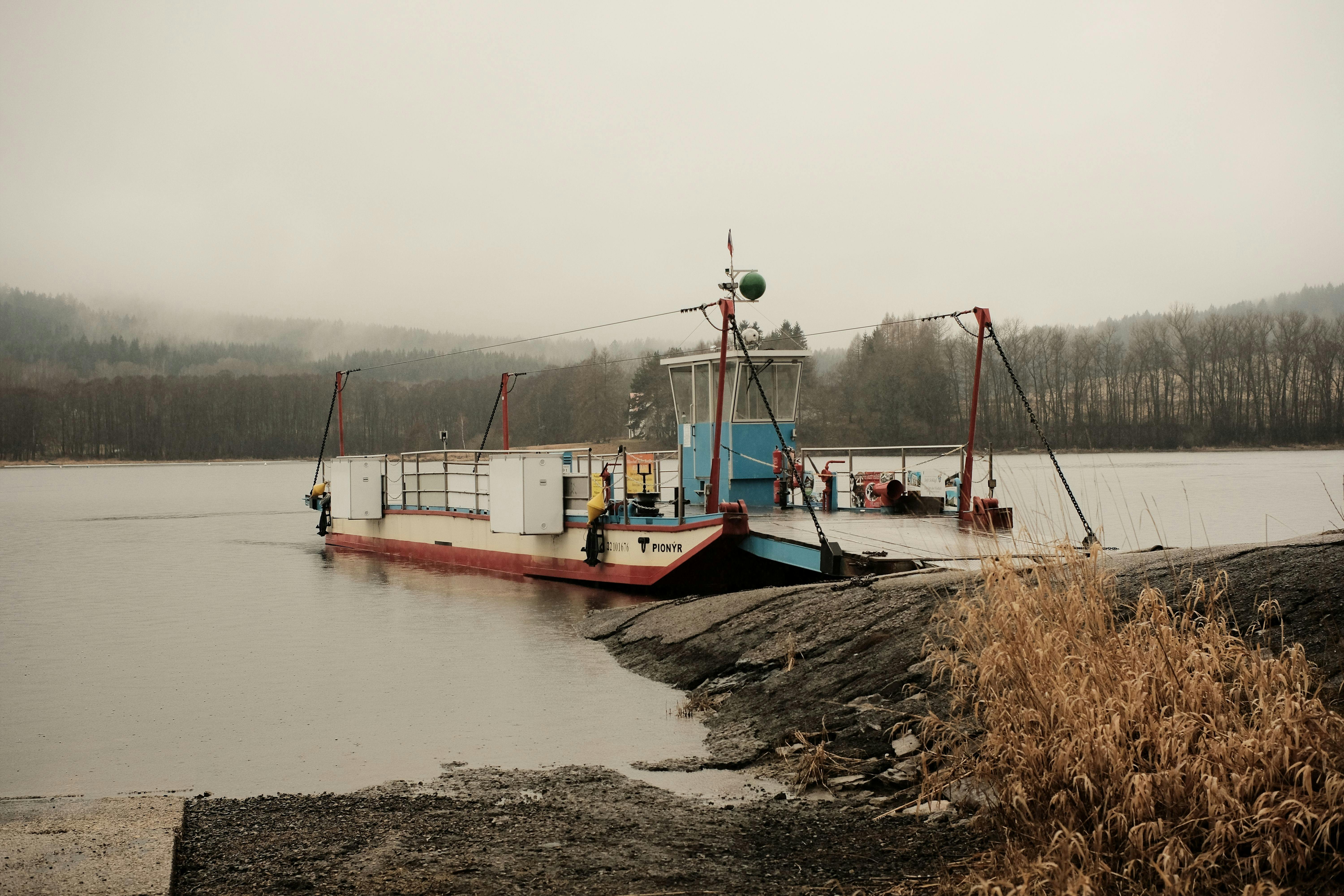 Scenic Dock and Ferry on Misty Lake · Free Stock Photo