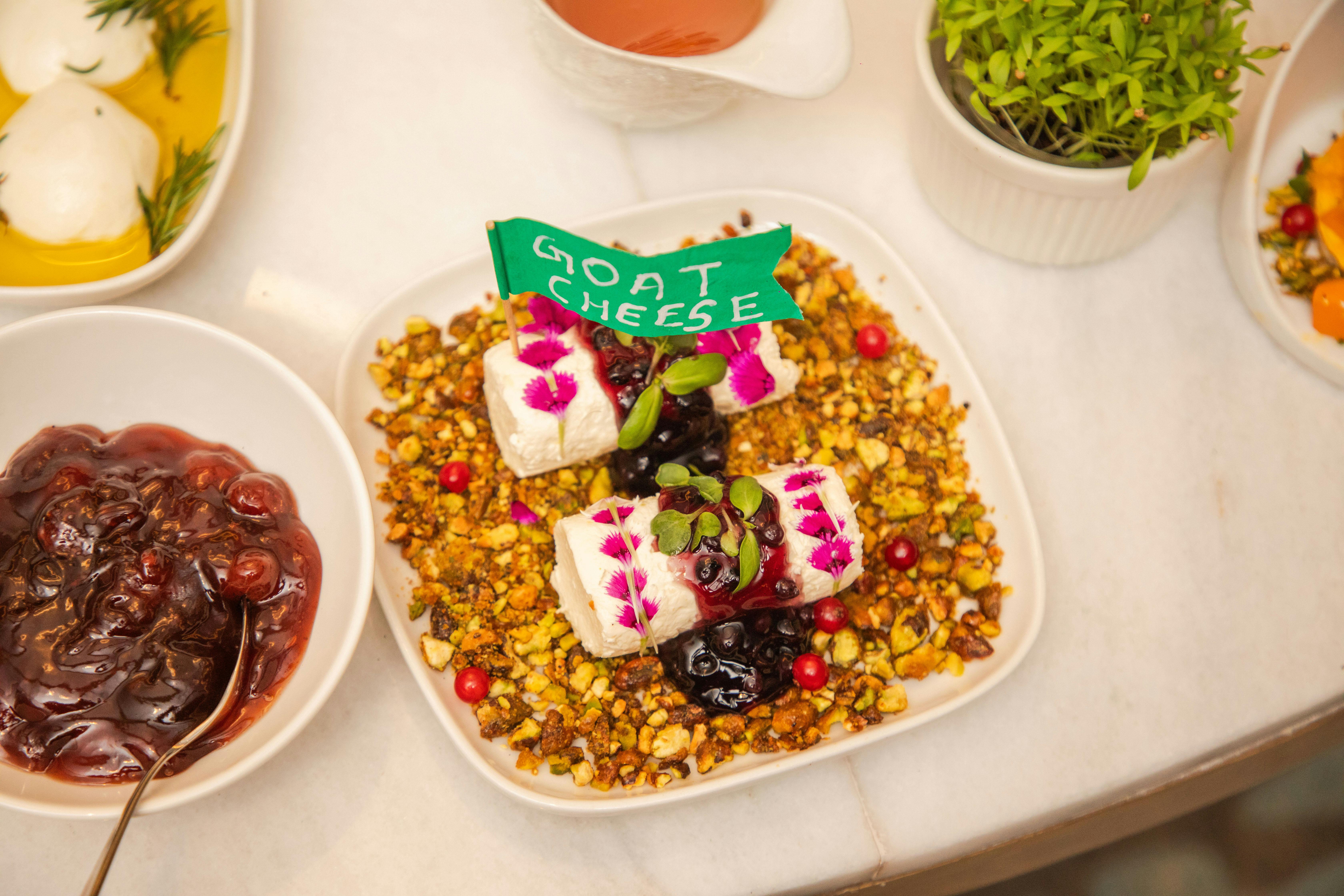 Creative Goat Cheese Platter with Berries and Nuts · Free Stock Photo