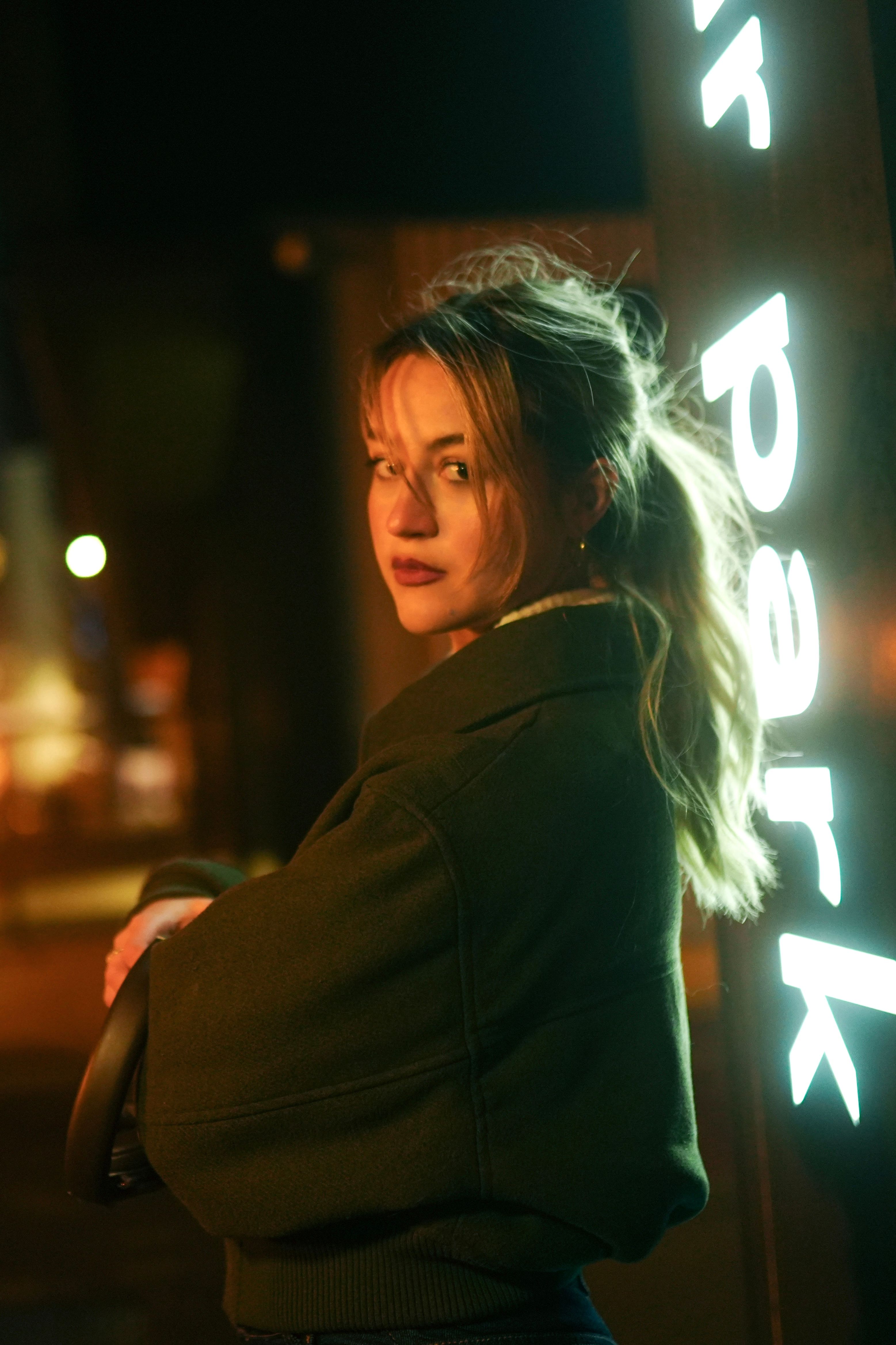 Stylish Woman at Night in Urban Setting · Free Stock Photo