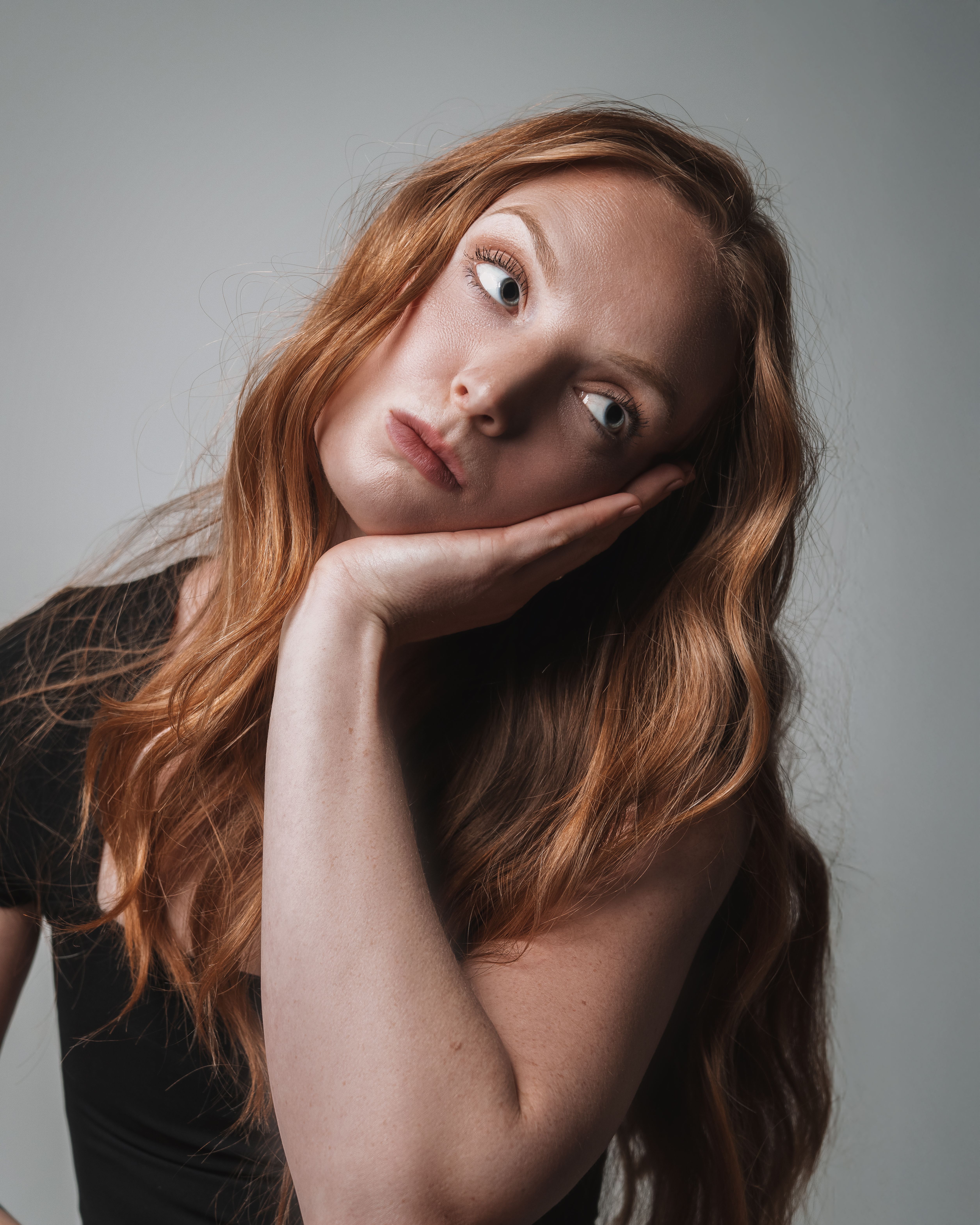 Expressive Portrait of a Woman with Ginger Hair · Free Stock Photo