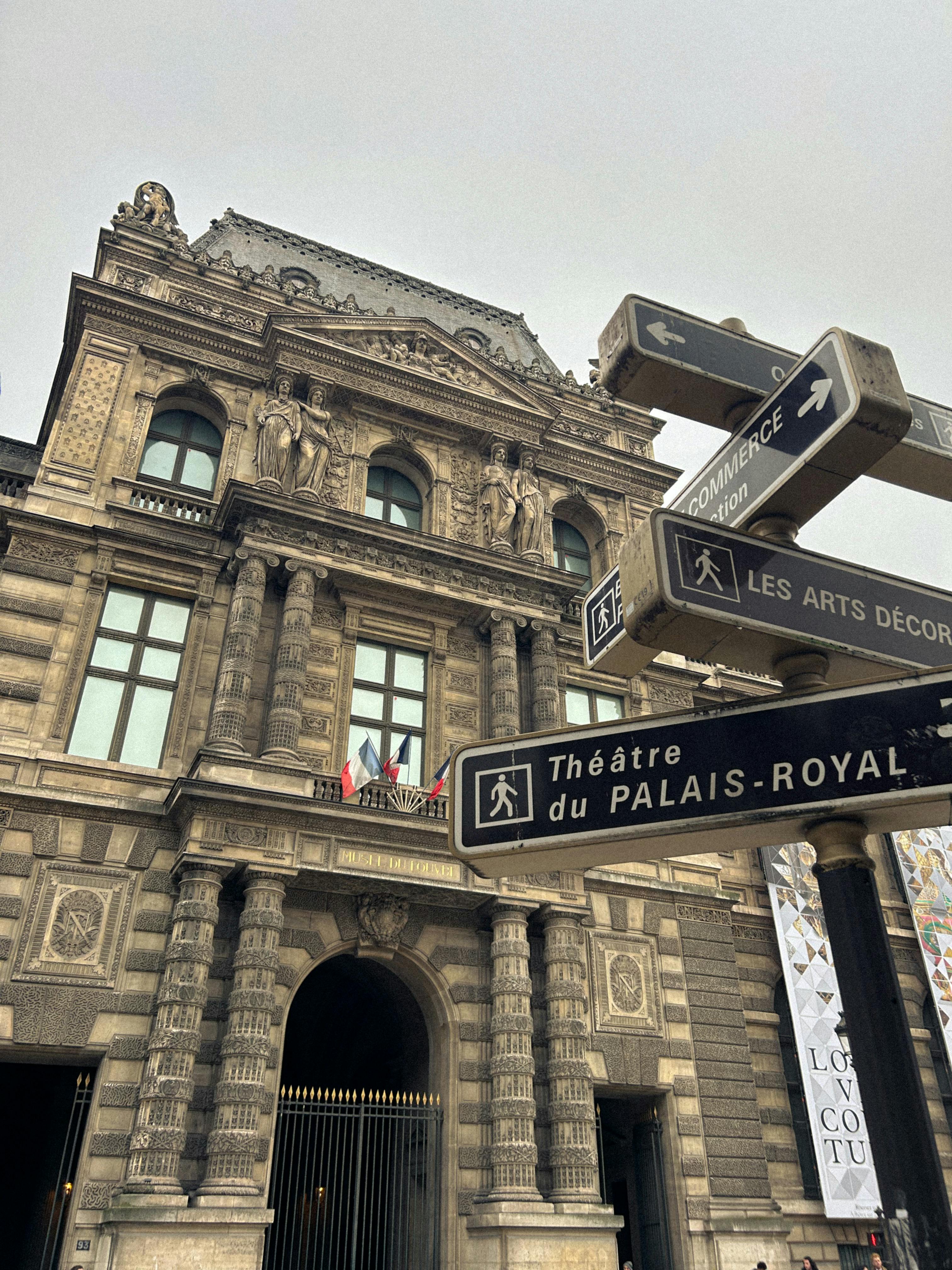 Signage in Front of Louvre's Decorative Arts Wing · Free Stock Photo