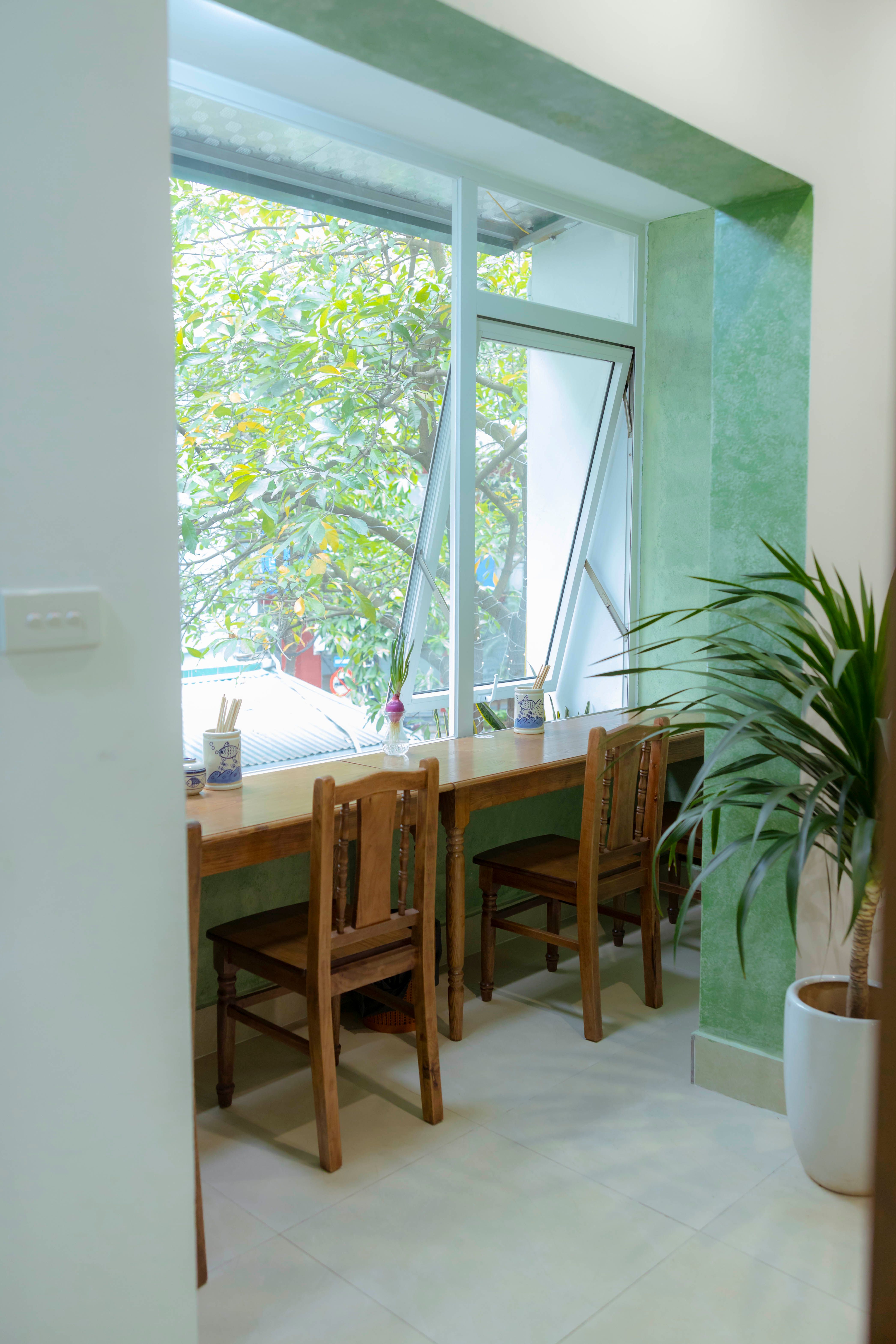 Cozy Indoor Cafe Seating by Window · Free Stock Photo